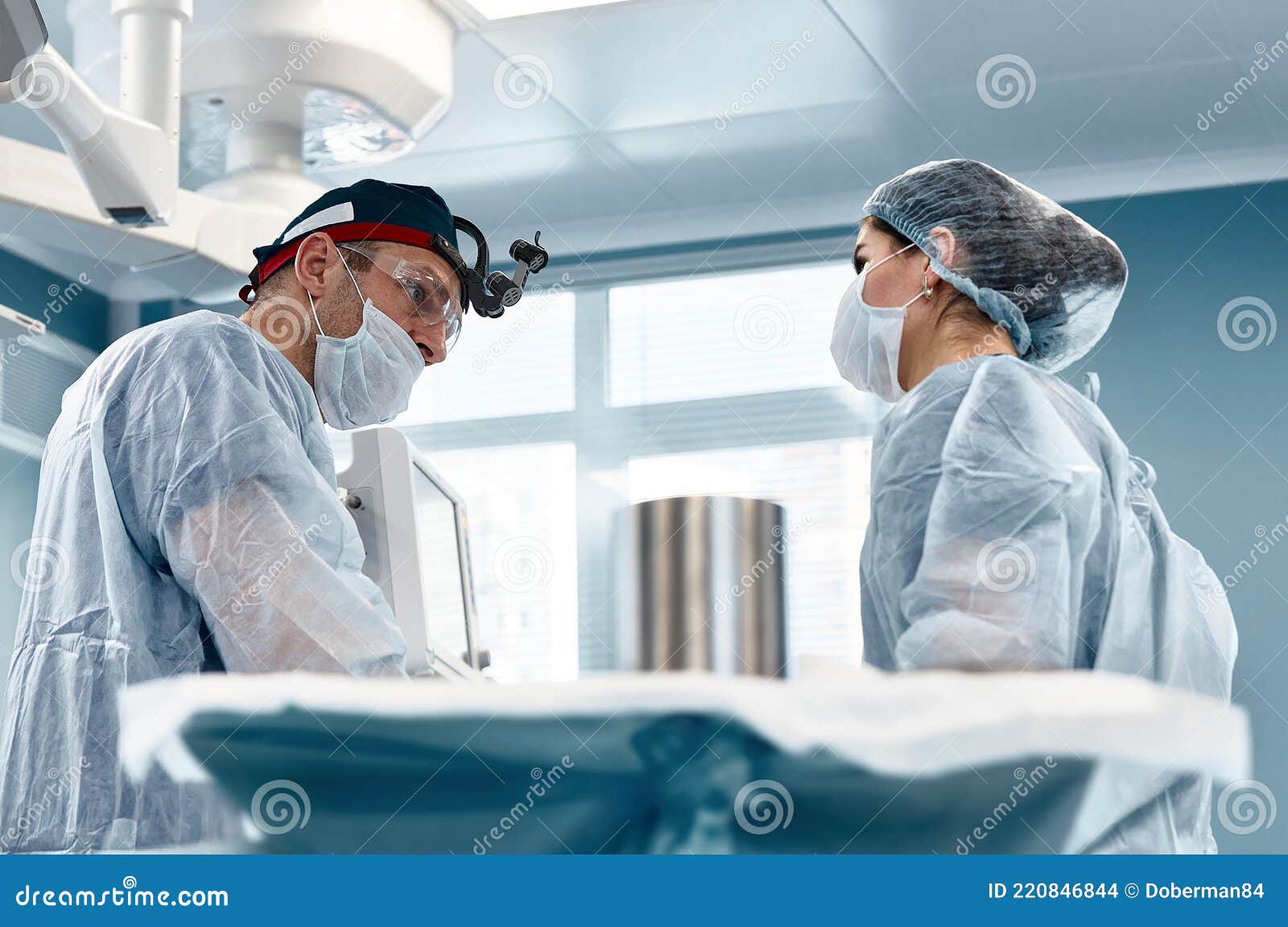 Surgeons Perform Plastic Surgery, Discussing the Progress of the ...