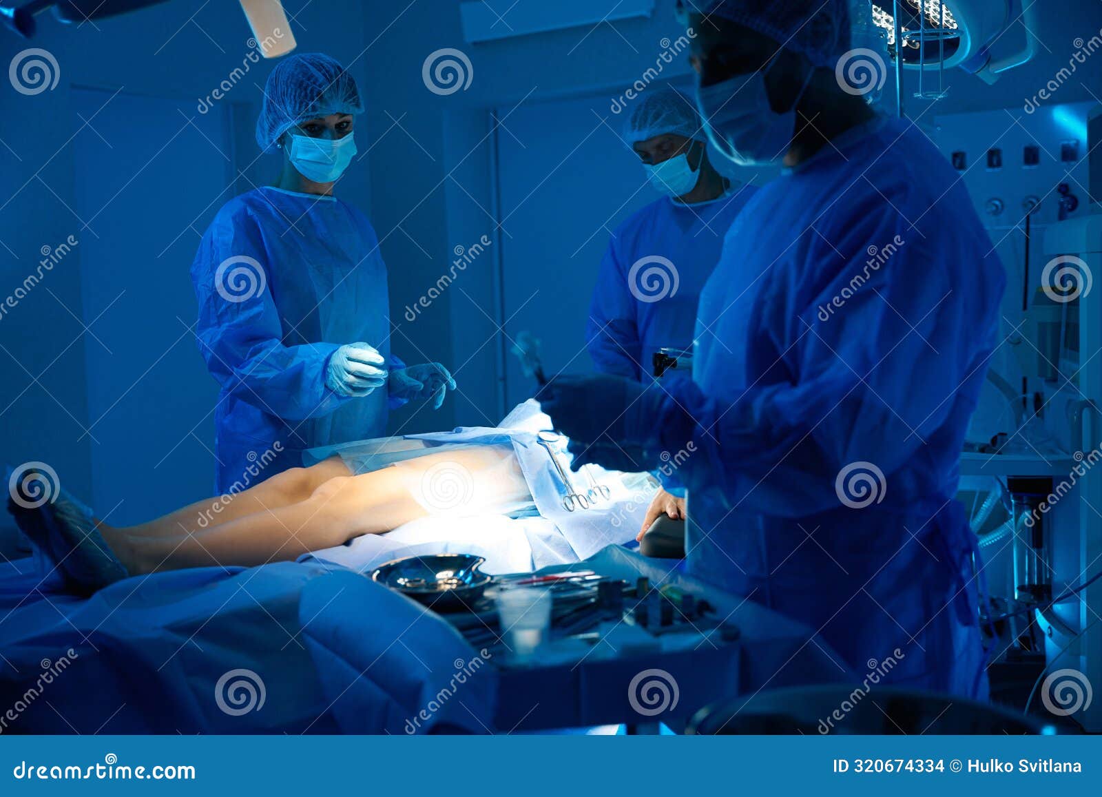 Surgeons Performing Surgical Procedure in Modern Operating Theater ...