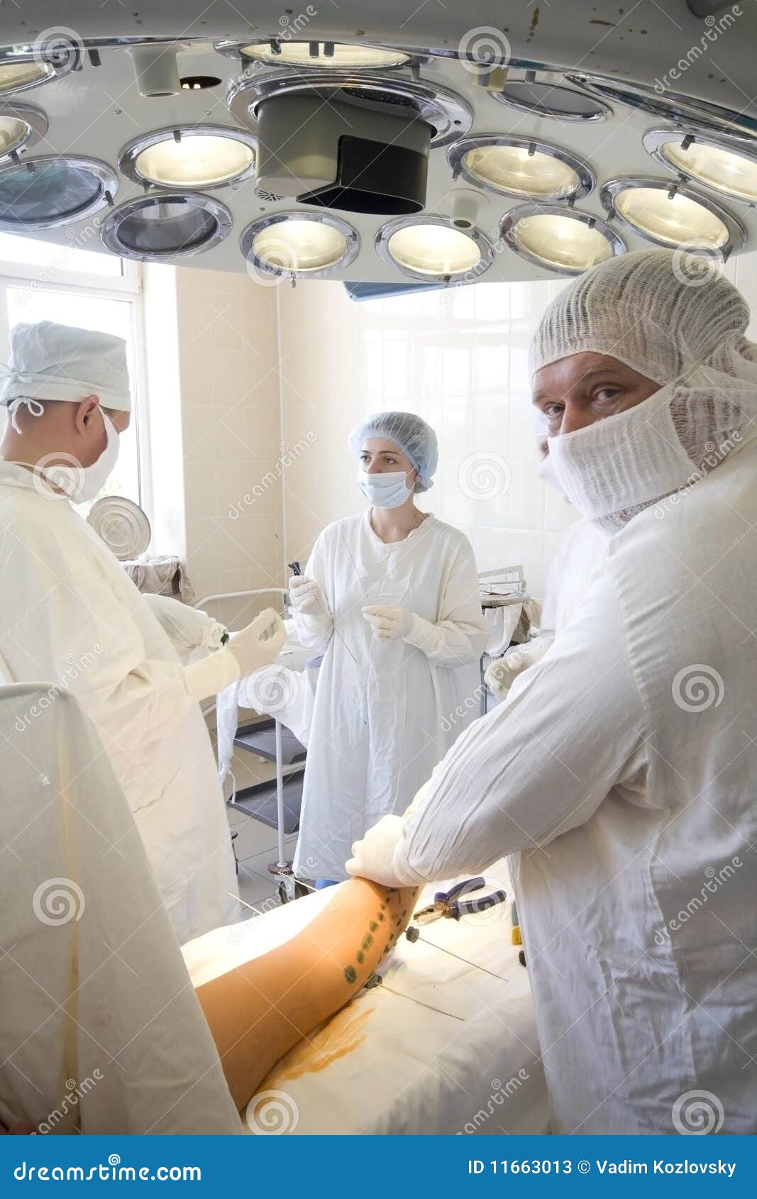 Surgeons team at work stock image. Image of operating - 11663013