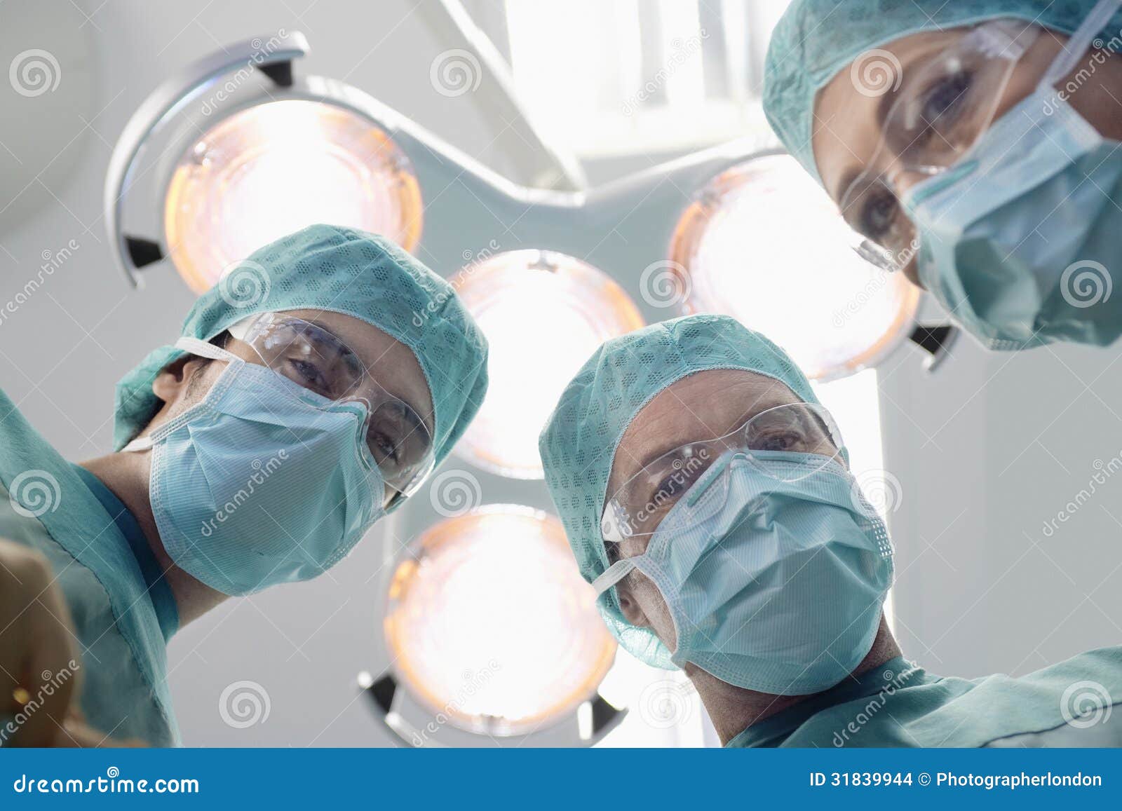 Surgeons Under Surgery Lights in Operating Theatre Stock Photo - Image ...