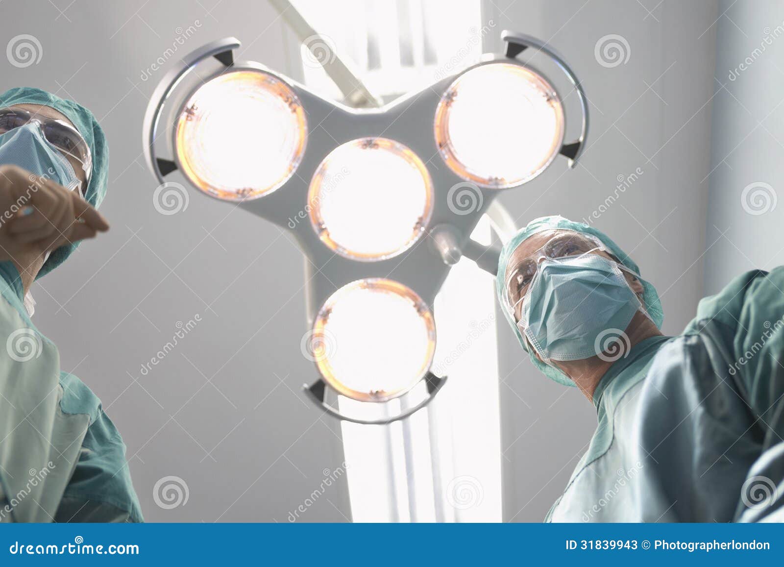 Surgeons Under Surgery Lights in Operating Theatre Stock Image - Image ...