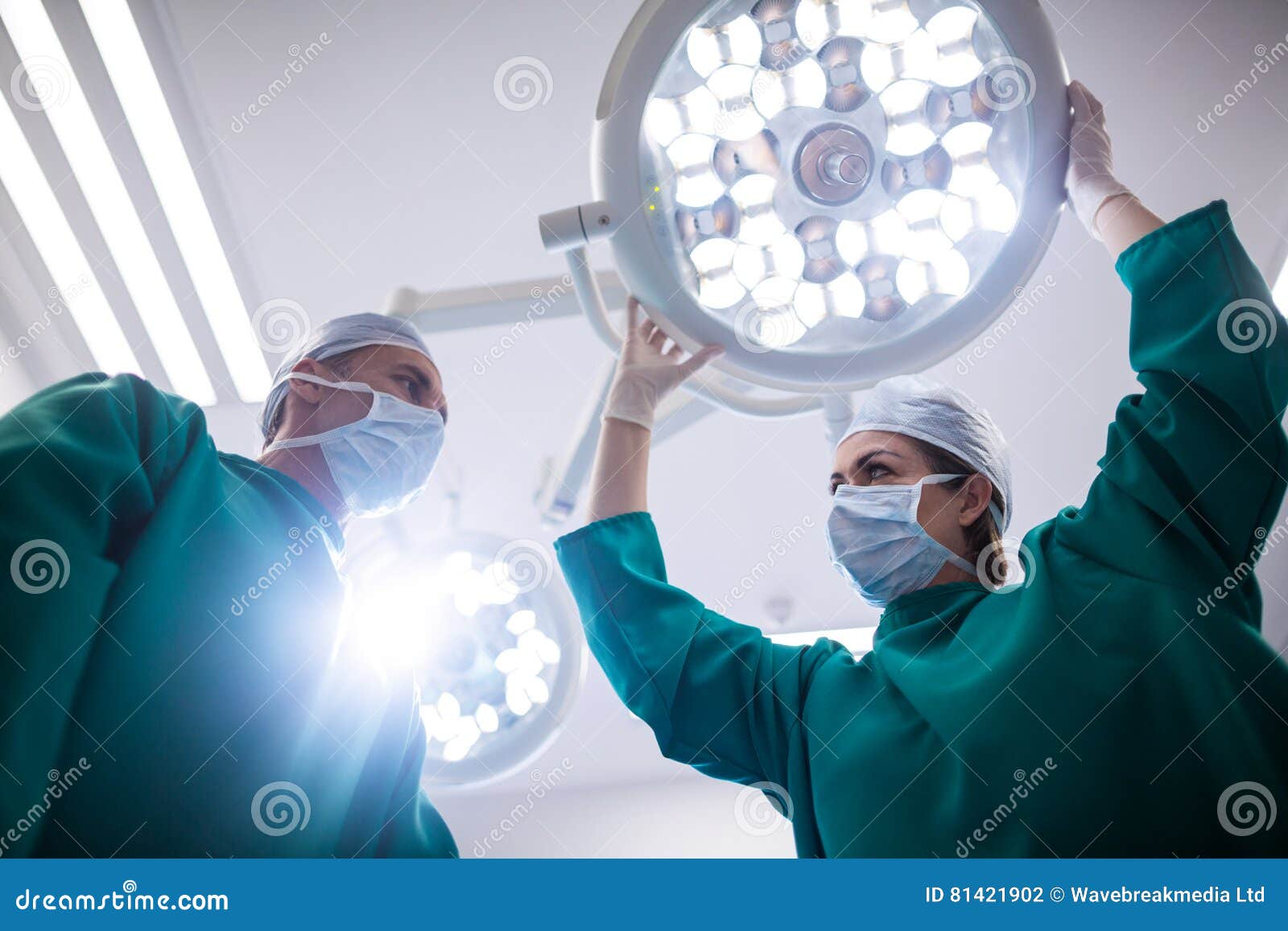 Surgeons Using Computer Monitor in Operation Room Stock Photo - Image ...