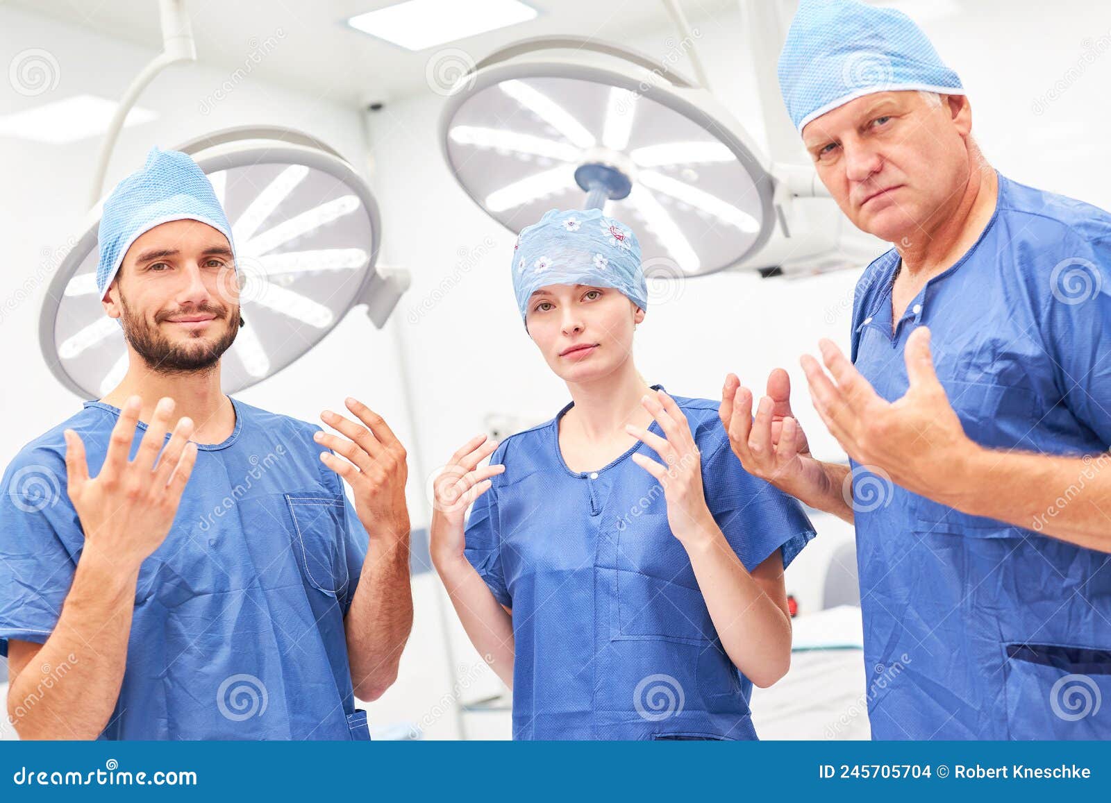Surgery Team with Sterile Hands after Disinfection Stock Photo - Image ...