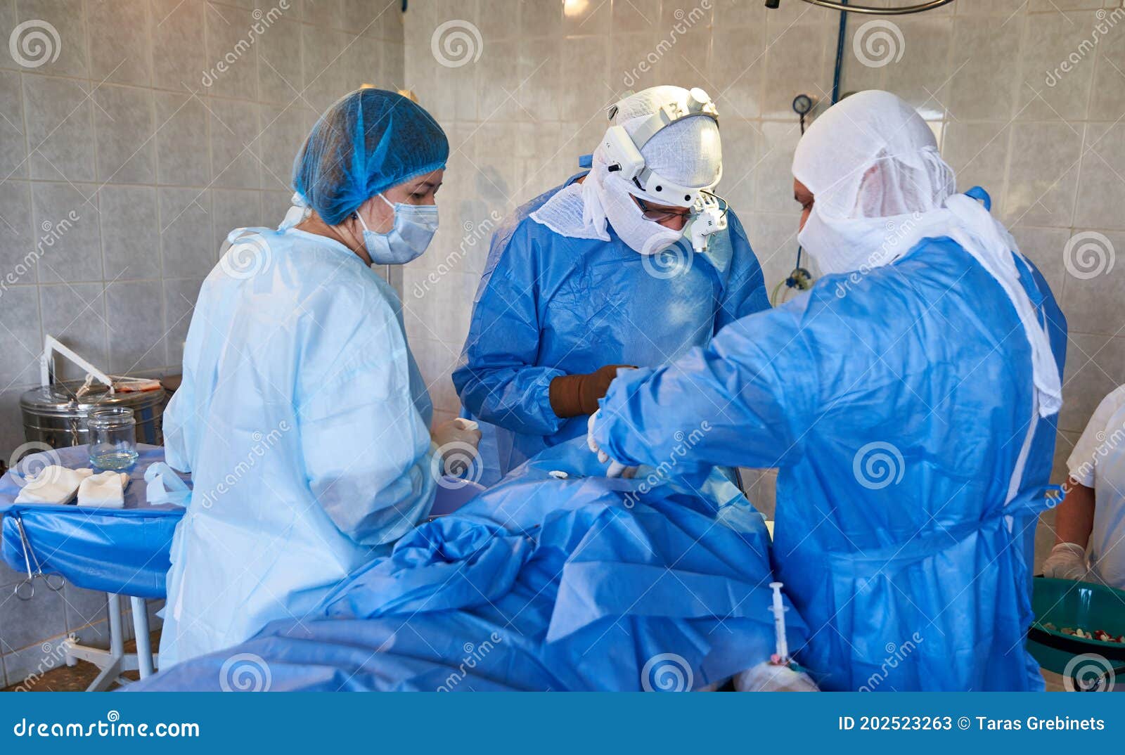 Surgery. View from the Patient`s Legs. the Surgical Team at Work Stock ...