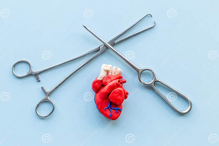 Surgical Instruments and Heart Model. Heart Surgery Concept Stock Photo ...