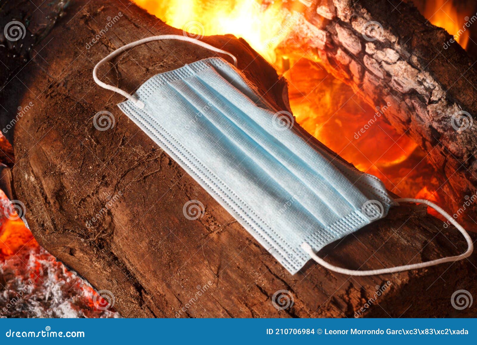 Surgical Mask Burning on Top of a Log with Fire, Concept of Ending ...