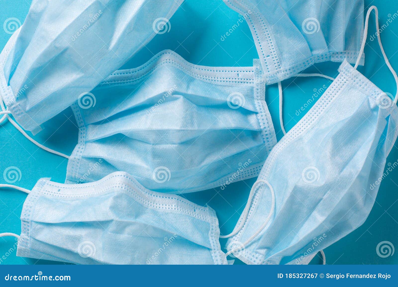 A Surgical Mask Isolated on Blue Background Stock Image - Image of ...