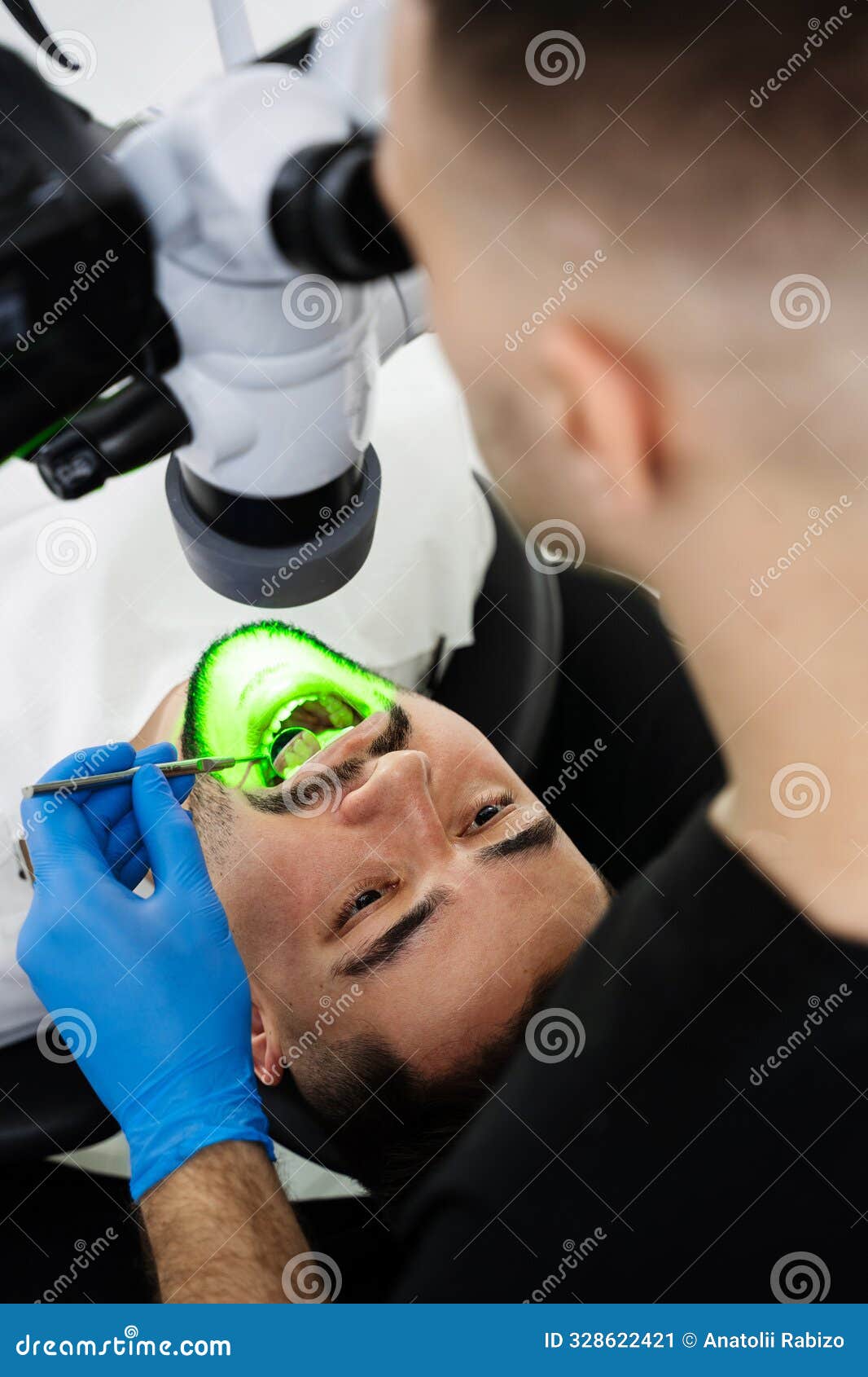 Surgical Microscope Examination Procedure. Dentist is Looking on Teeth ...