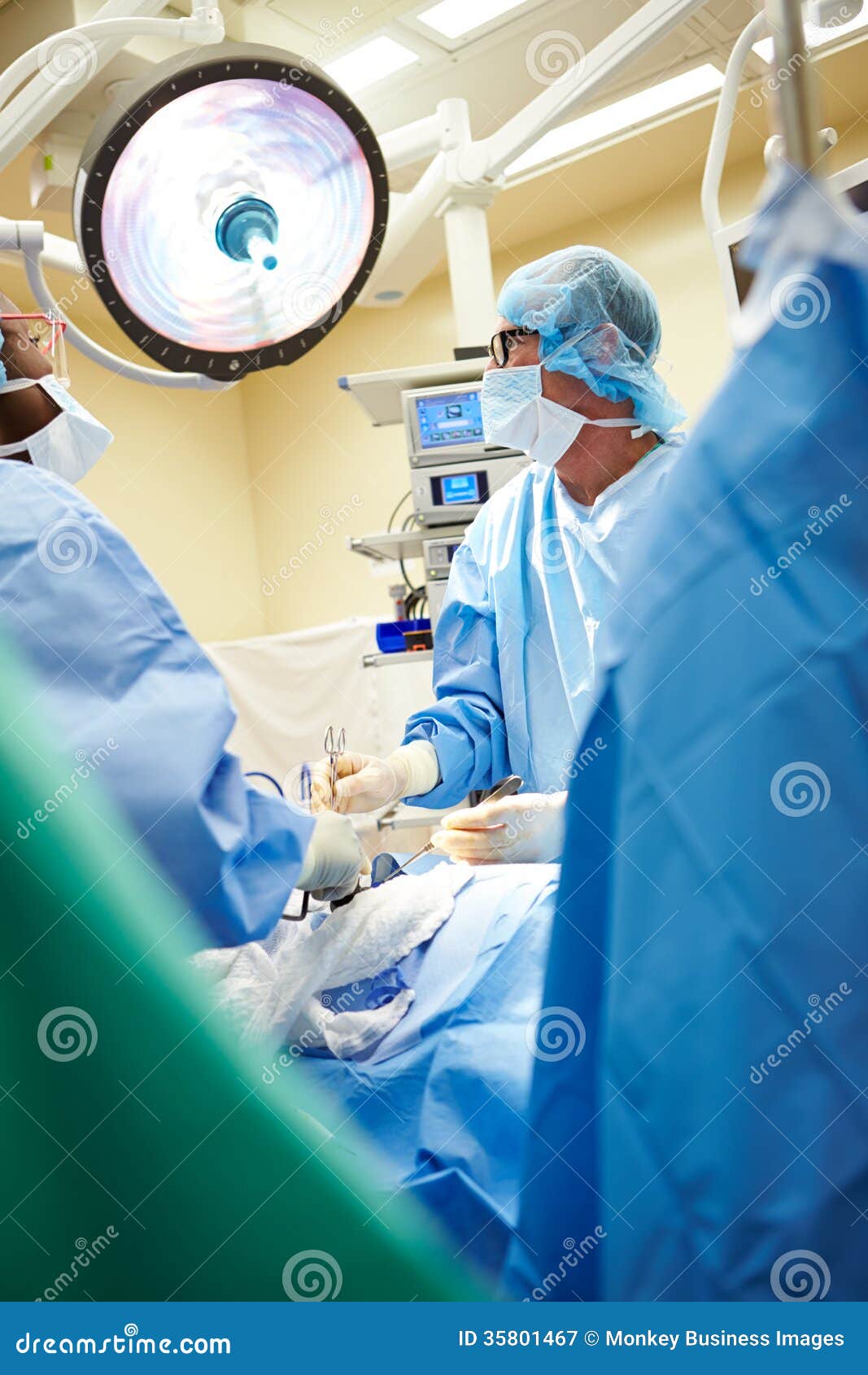 Surgical Team Performing A Cosmetic Surgery In Hospital Operating Room ...