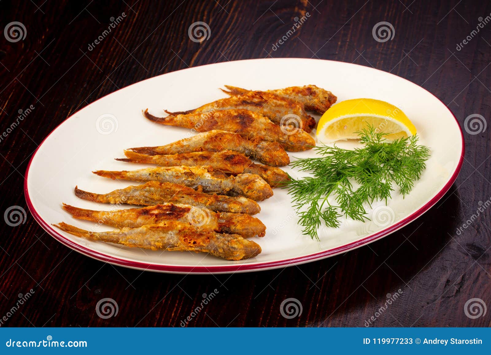 Surmullet fish with lemon stock image. Image of meal - 119977233