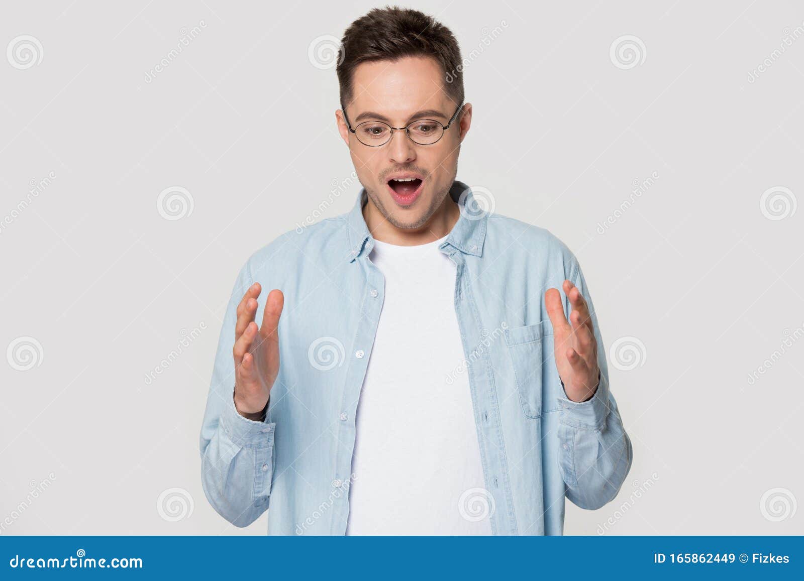 Surprised Amazed Young Man Demonstrates Big Size Wide Copy Space Stock