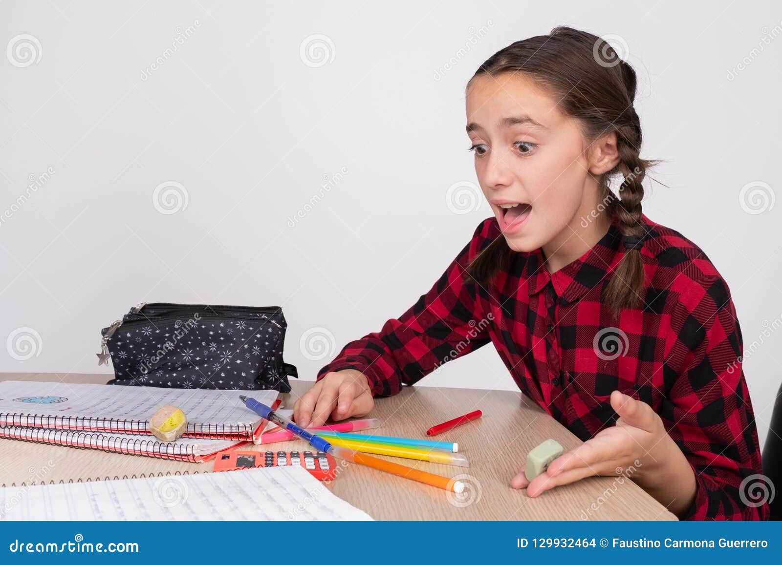 Surprised and Angry Girl Doing the Homework of the School Stock Photo ...