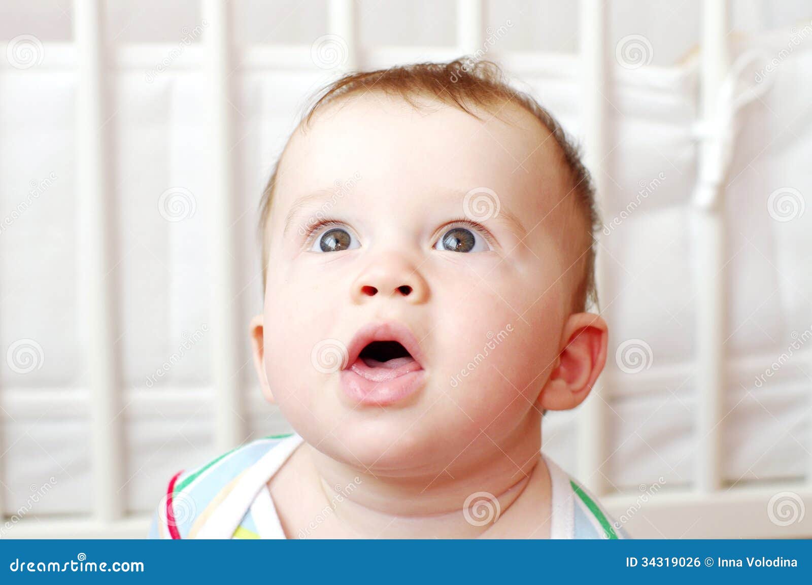Surprised Baby Against White Bed Stock Photo - Image of baby, nice ...