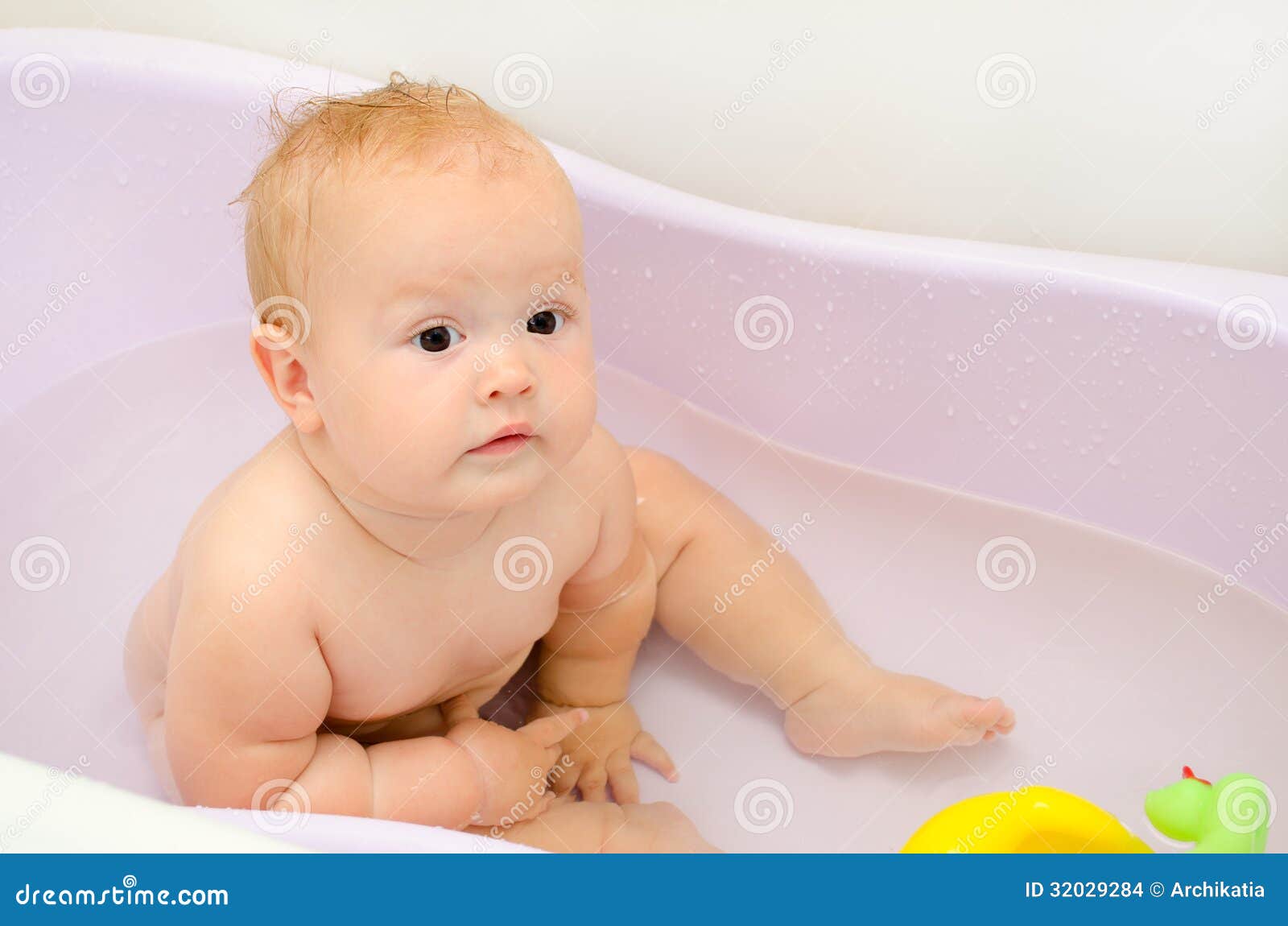 Surprised baby in the bath stock photo. Image of surprise - 32029284