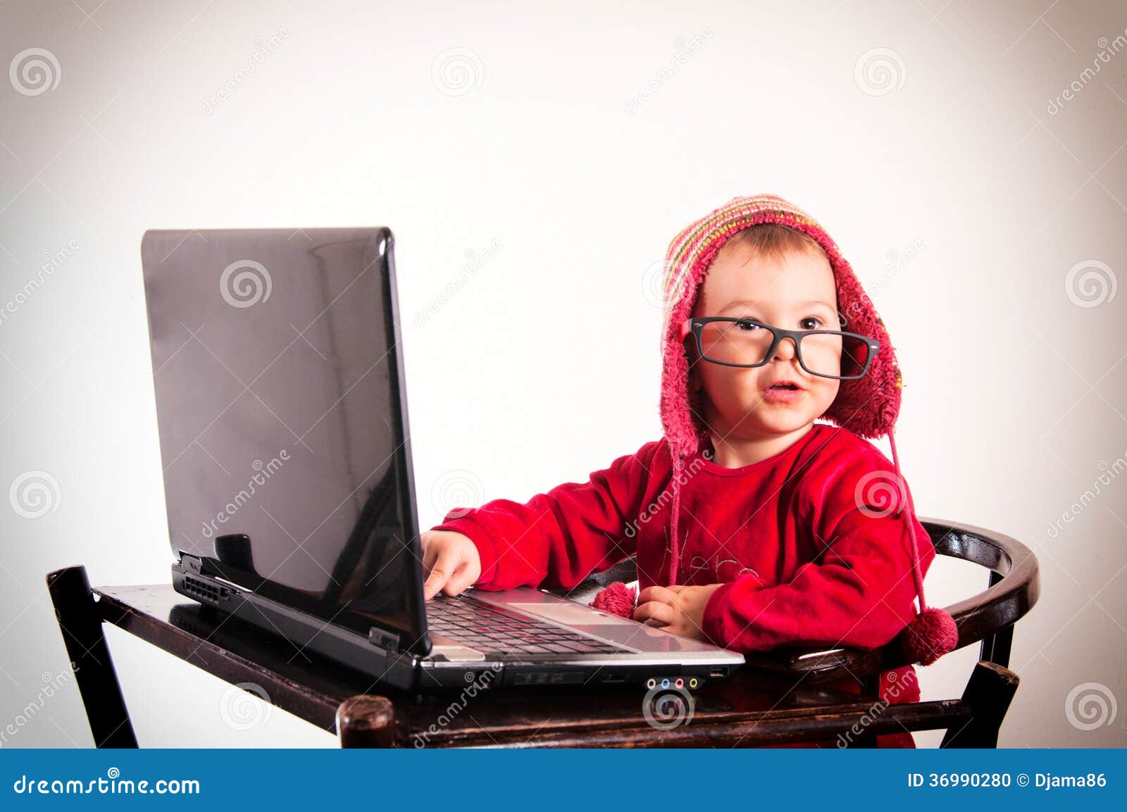 Surprised baby with laptop stock photo. Image of laptop - 36990280