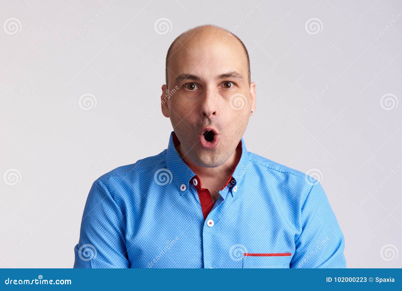 Surprised bald man on grey stock image. Image of shock - 102000223