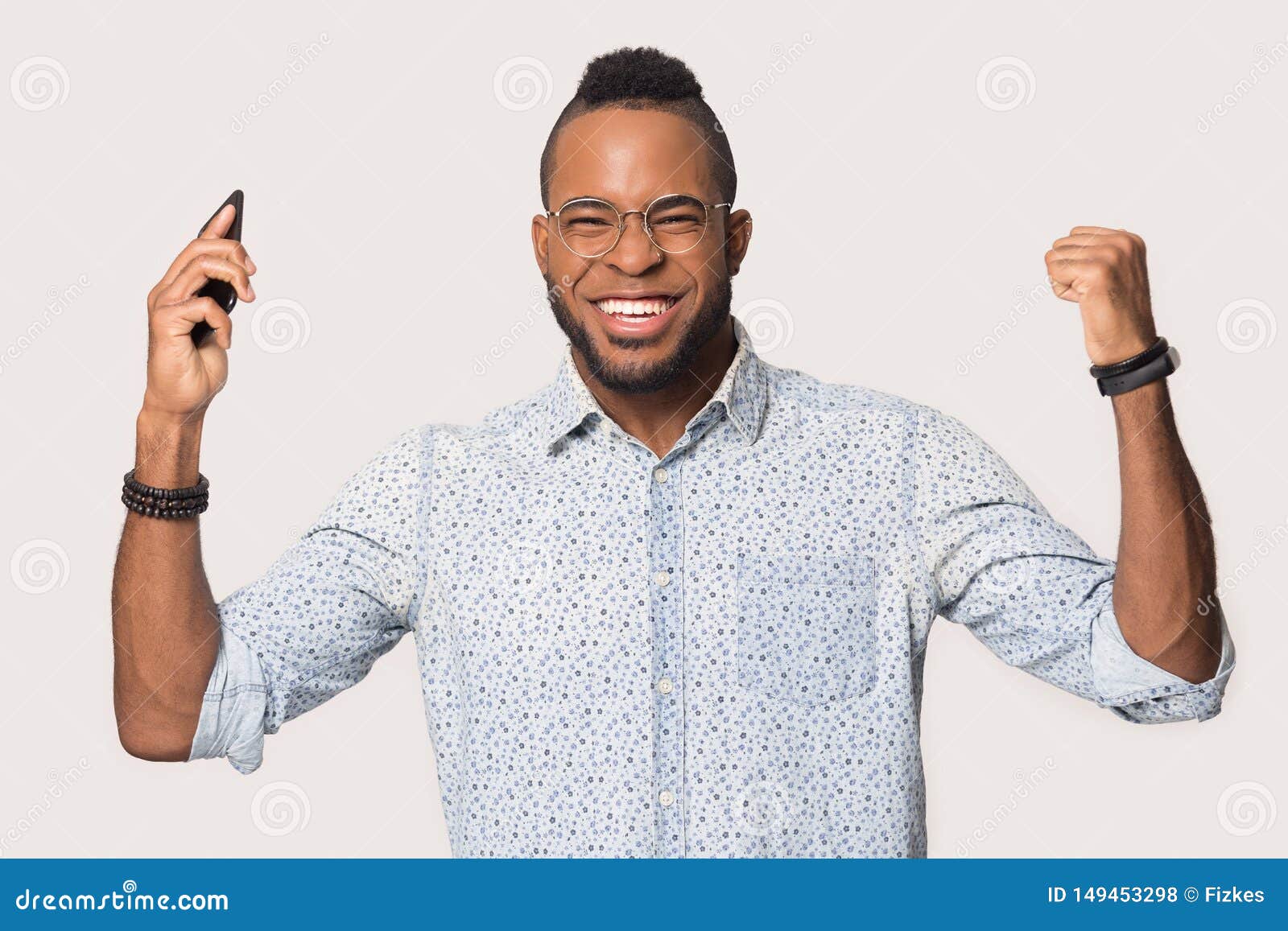 Surprised Black Man Confused By Unexpected Message On Smartphone Stock