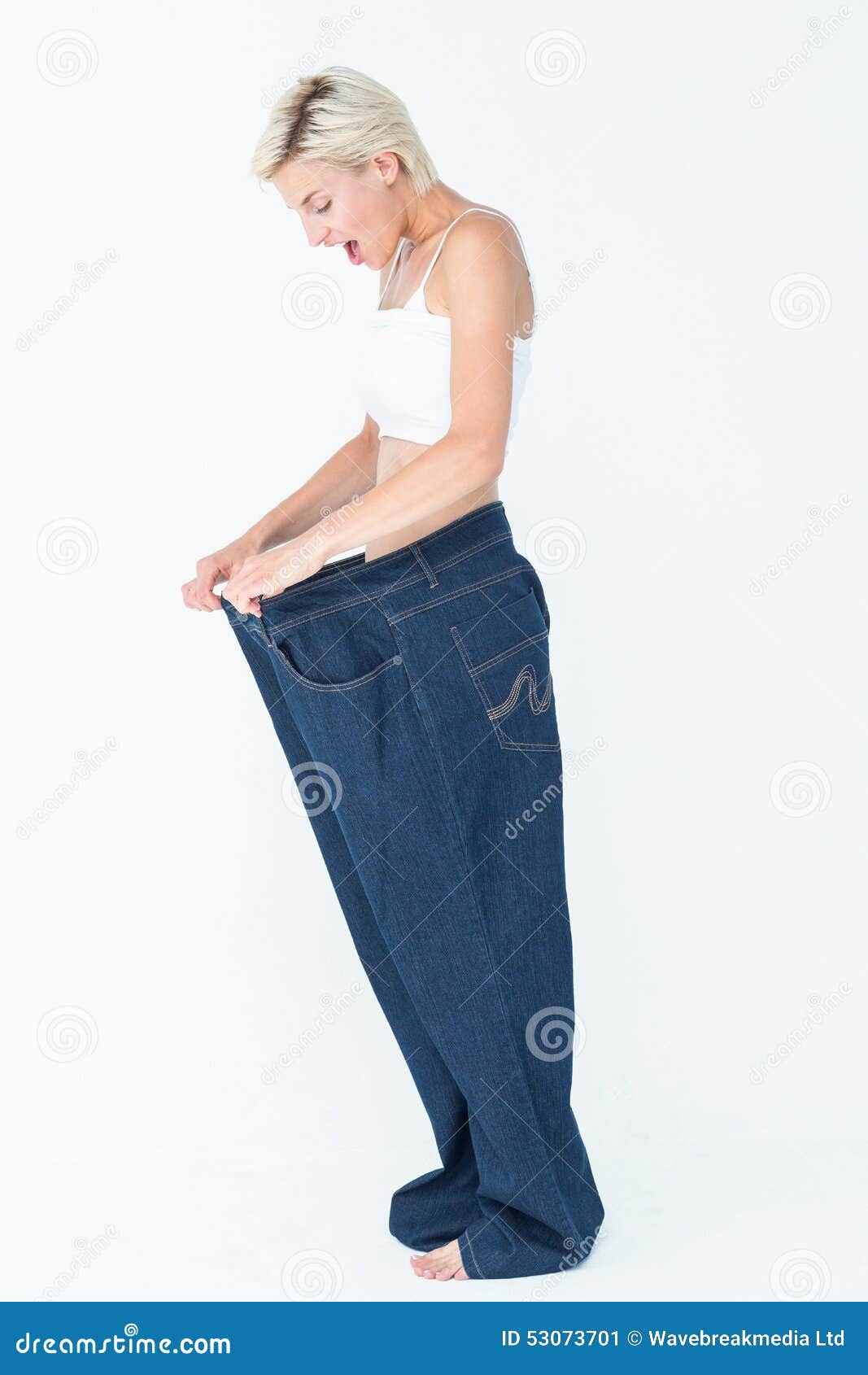 Surprised Blonde Wearing Too Large Pants Stock Image - Image of hair ...