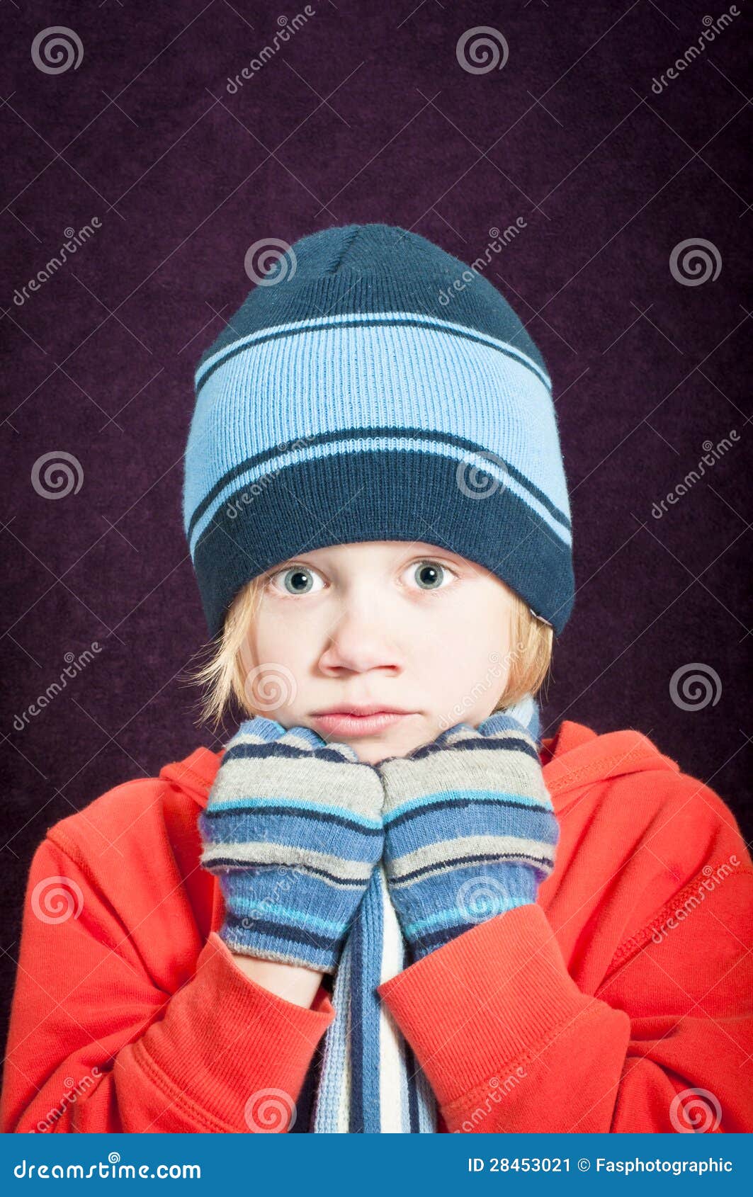 Surprised boy keeping warm stock image. Image of kids - 28453021