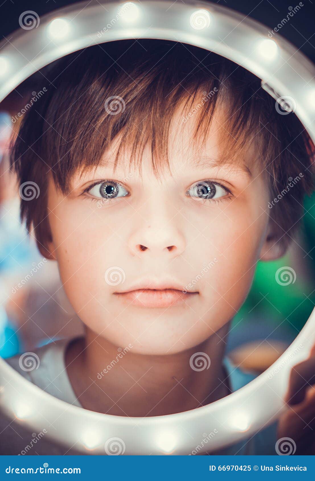 Surprised Boy Looking at the Camera through a Luminous Circle As an ...
