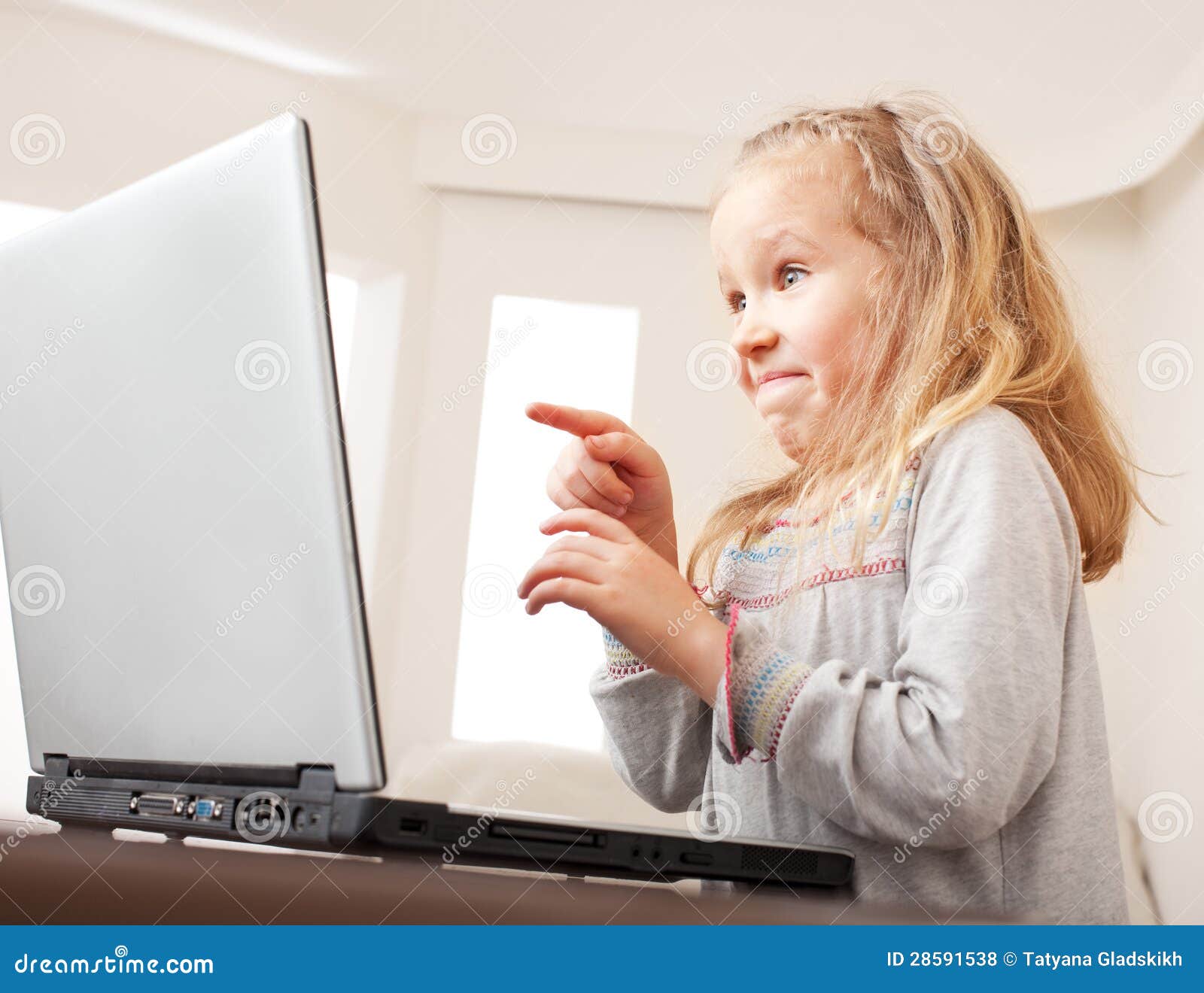 Surprised Child with Laptop Indoors Stock Photo - Image of playful ...