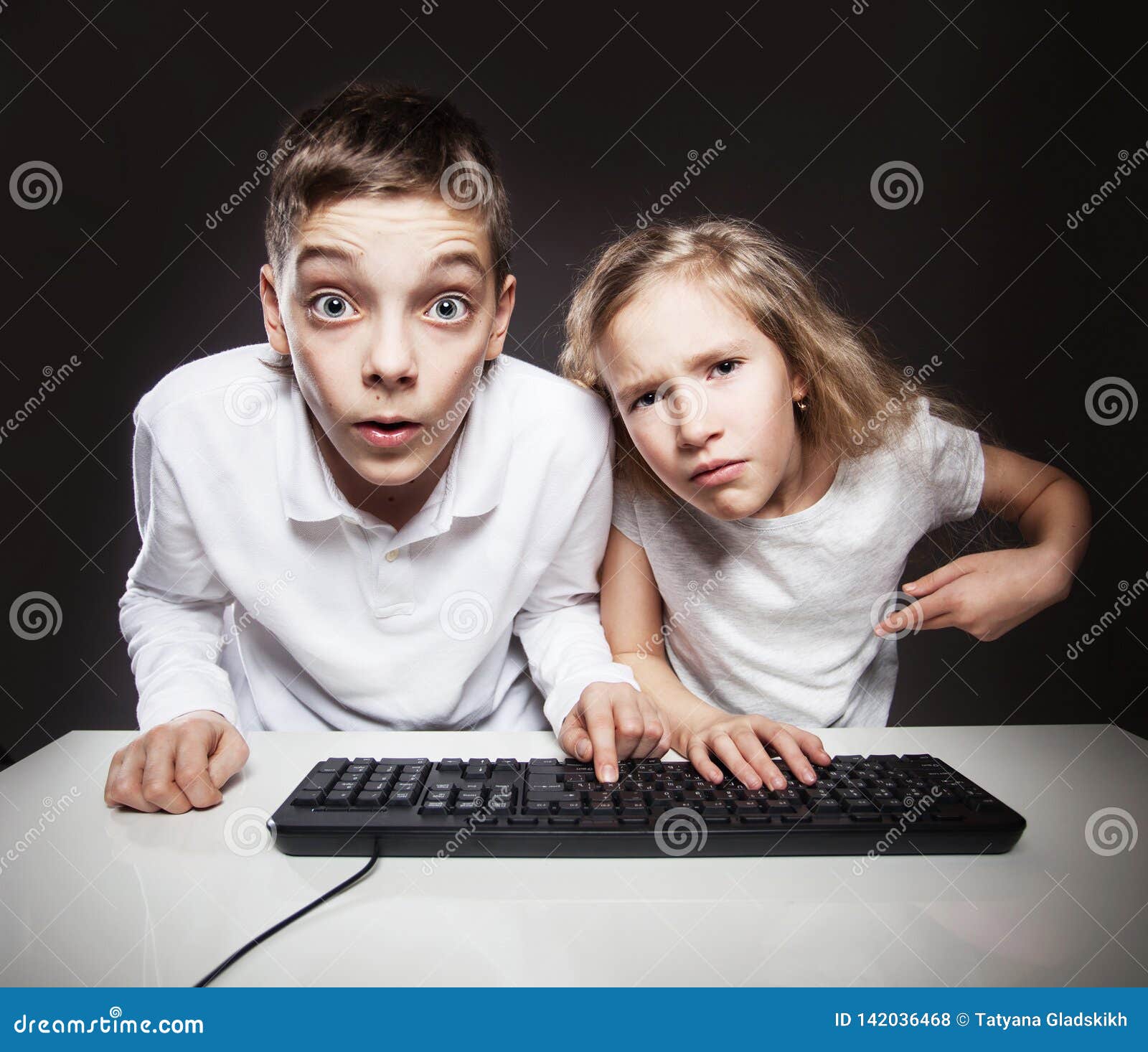 Surprised Children Looking at a Computer Stock Photo - Image of ...