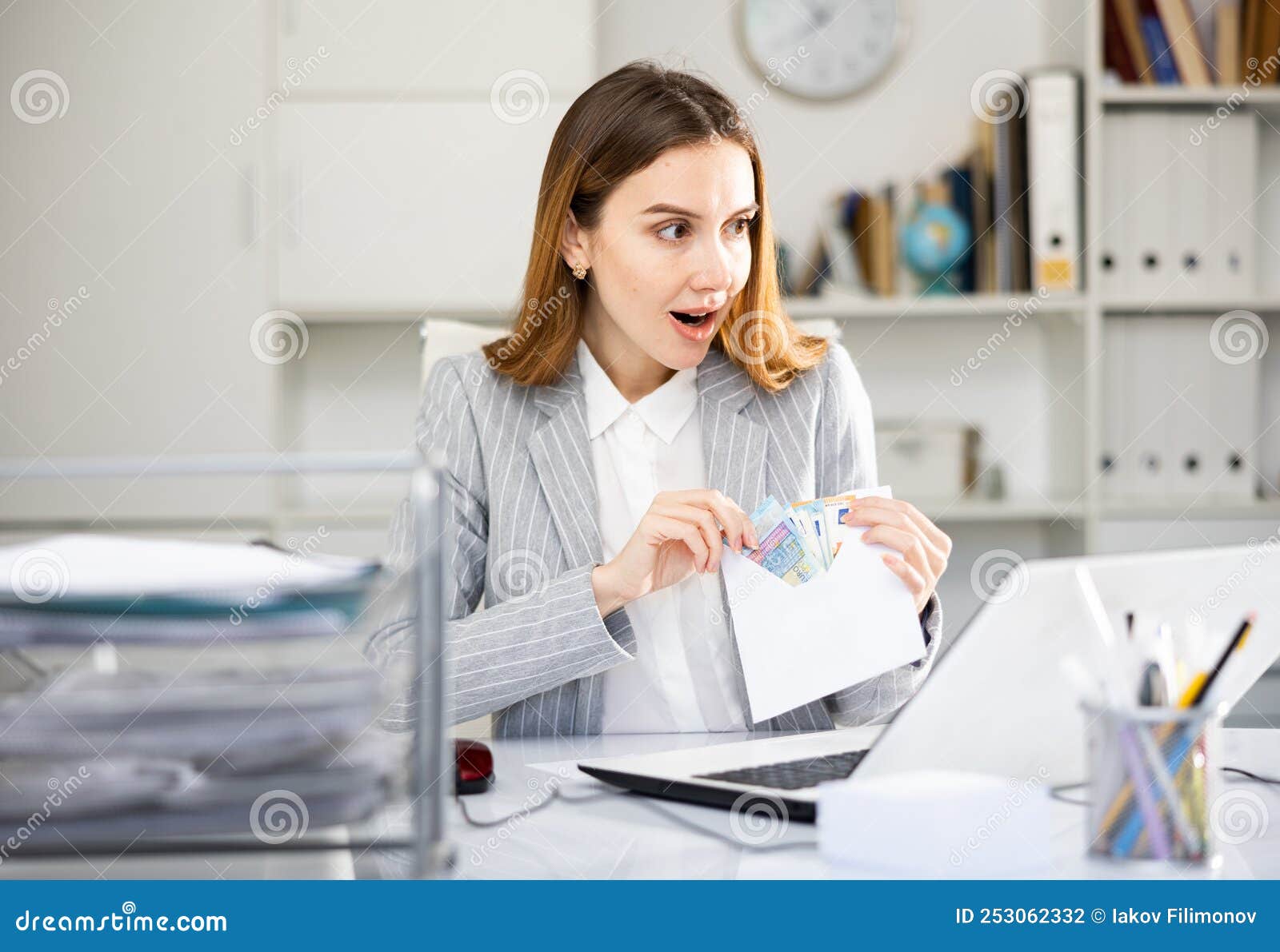 Surprised Female Manager Takes Out Banknotes from an Envelope in Modern ...