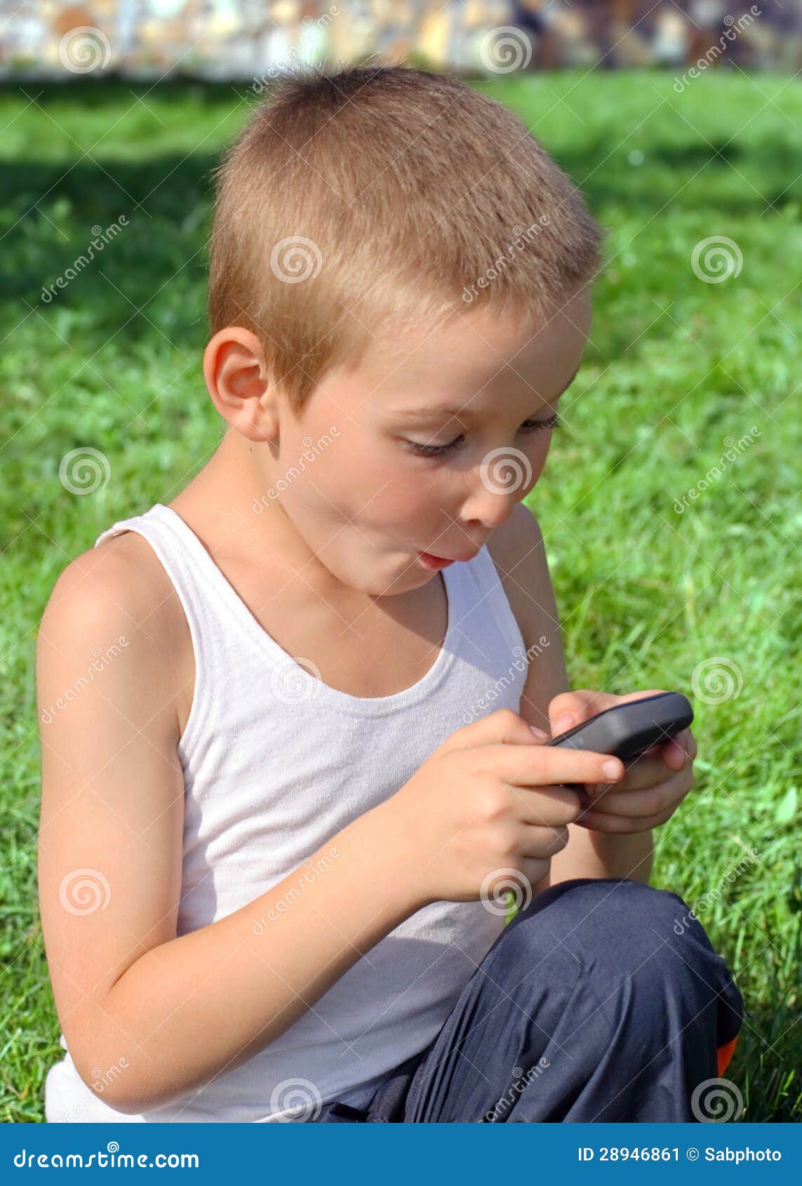 Surprised Kid with Mobile Phone Stock Image - Image of outdoors, field ...
