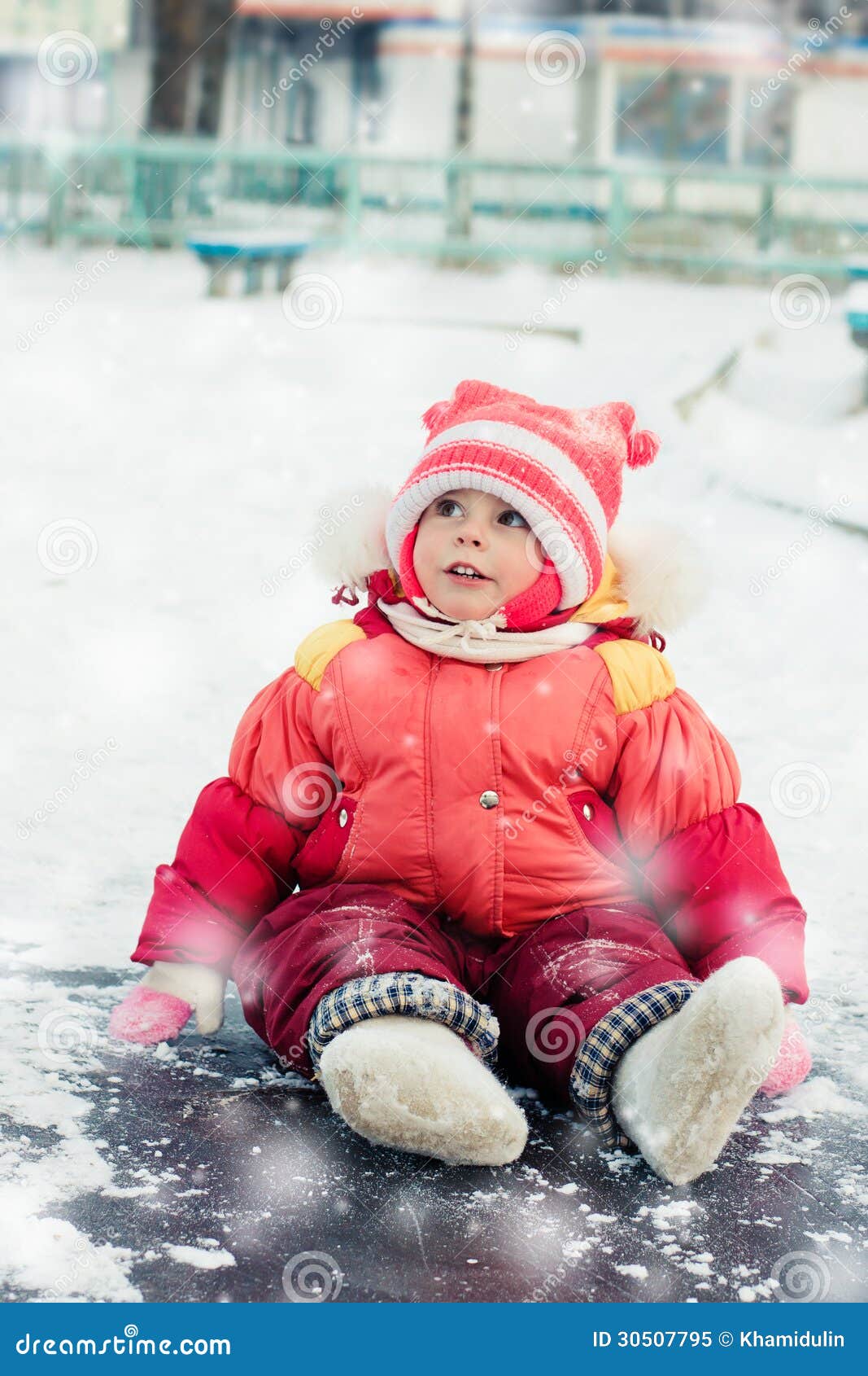Surprised Kid Sitting on the Ice in Winter. Stock Image - Image of ...