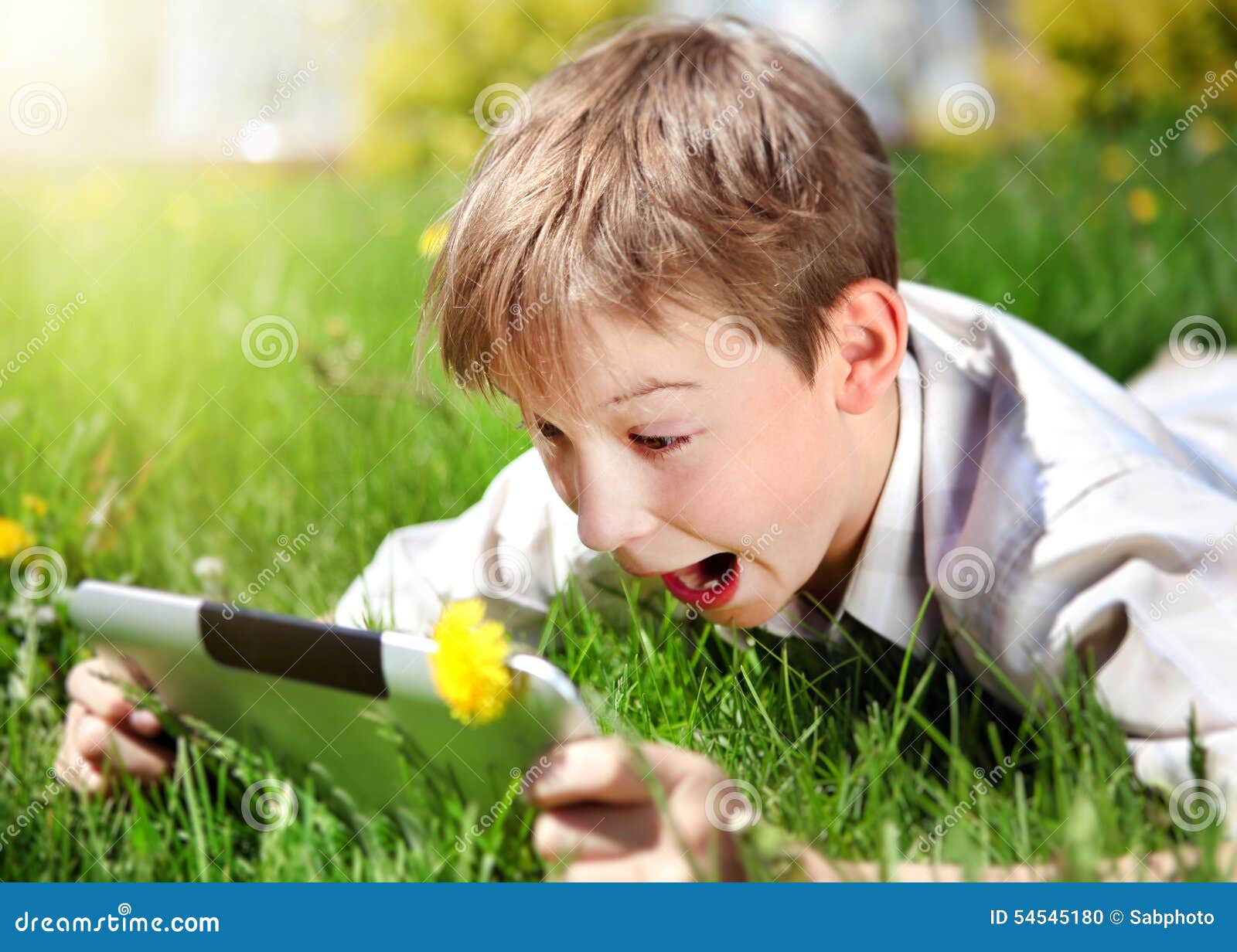 Surprised Kid with Tablet stock photo. Image of childhood - 54545180