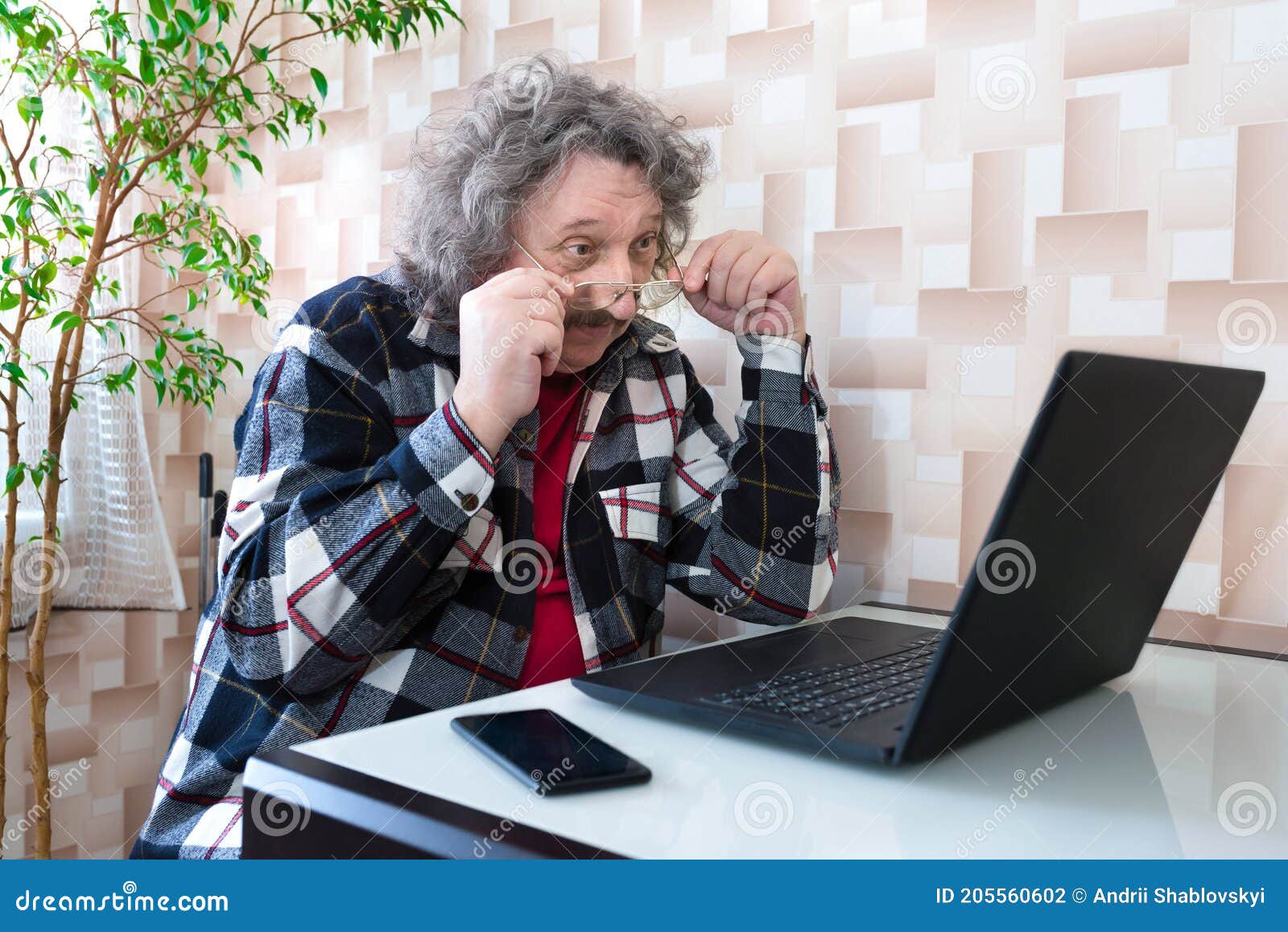 A Surprised Look of an Elderly Man Looking at the Laptop Stock Photo ...