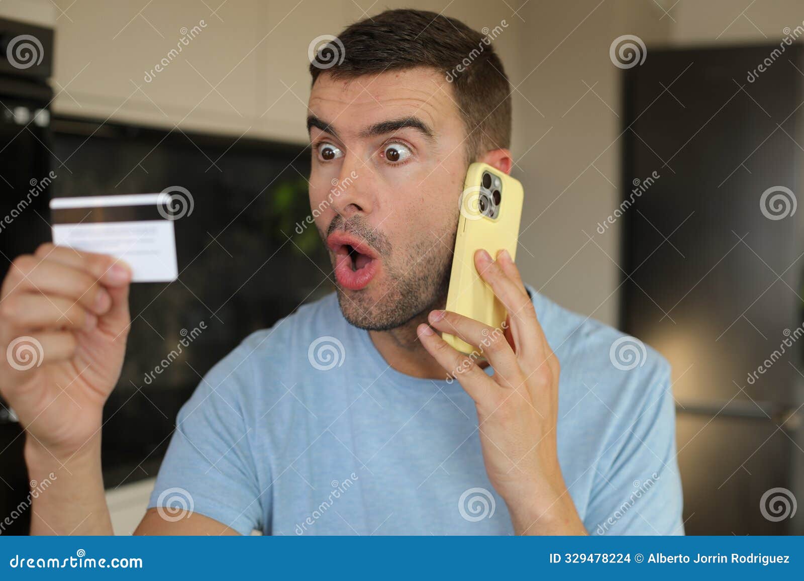 Surprised Looking Man Paying Online with His Credit Card Stock Photo ...