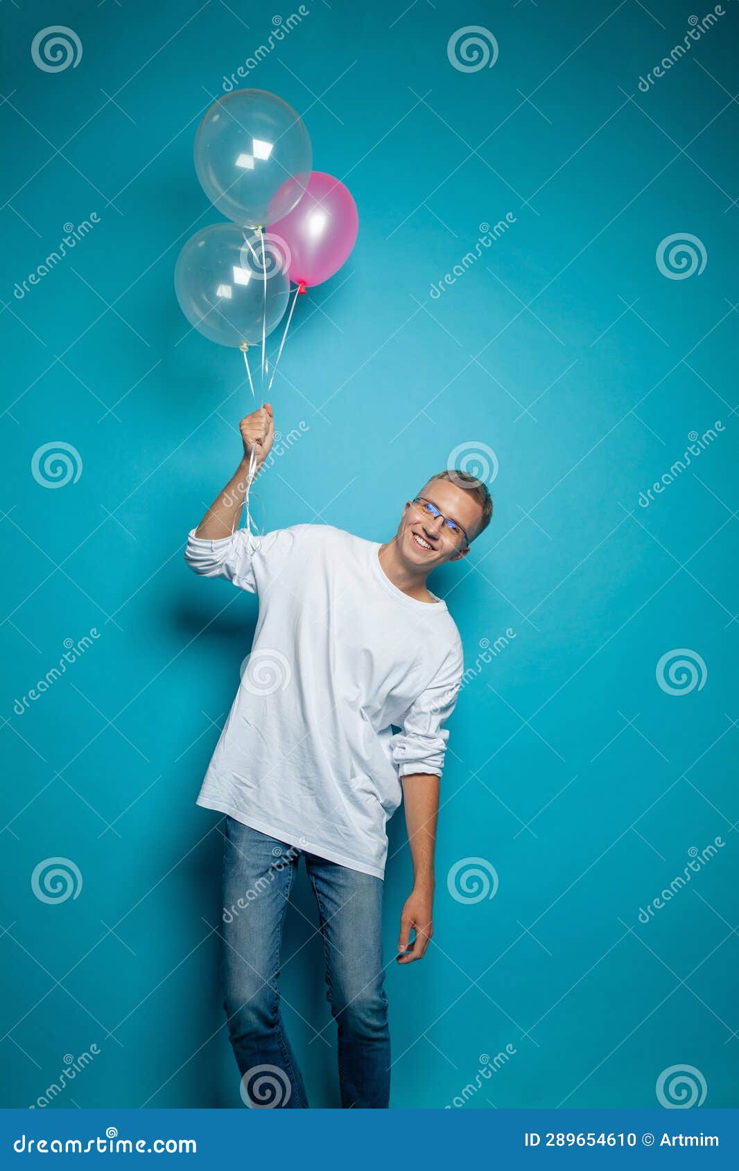 Surprised Man with Balloon Standing Against Colorful Blue Studio Wall ...