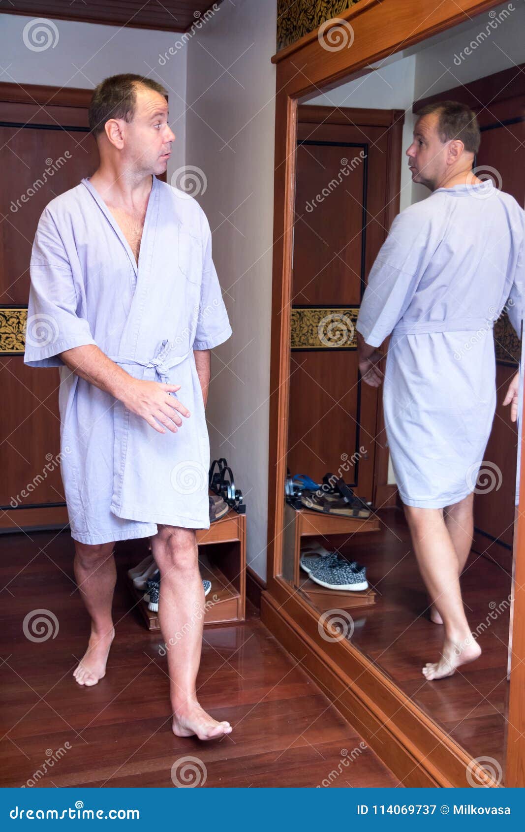 Reflection of Man in the Mirror is Walking Back. Stock Image - Image of ...