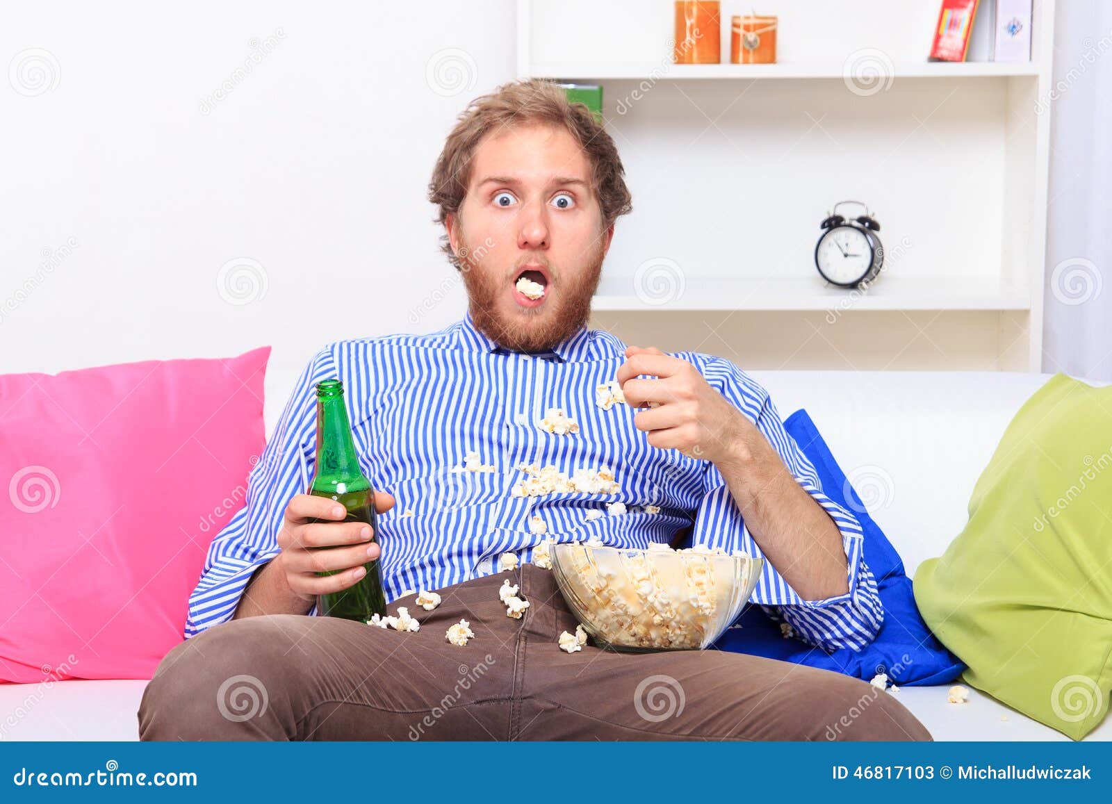 Surprised Man Eating Popcorn on the Sofa Stock Image - Image of eating ...