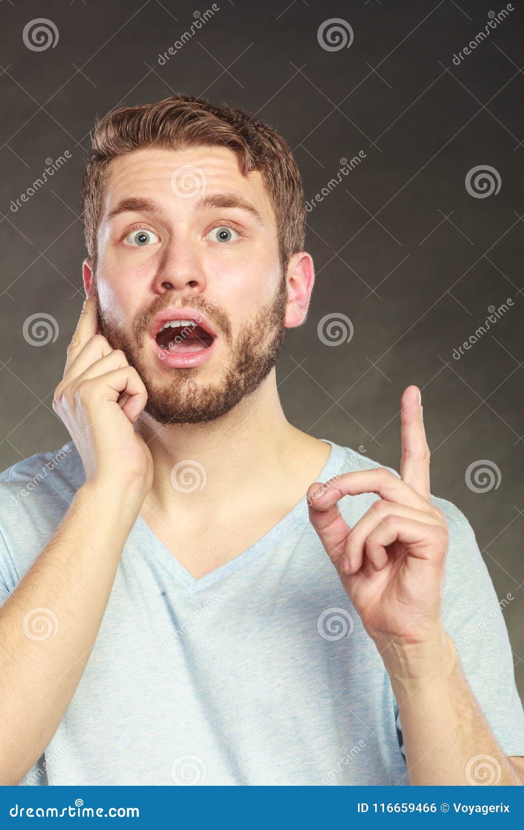 Surprised Man Pointing at Empty Blank Copy Space. Stock Photo - Image ...