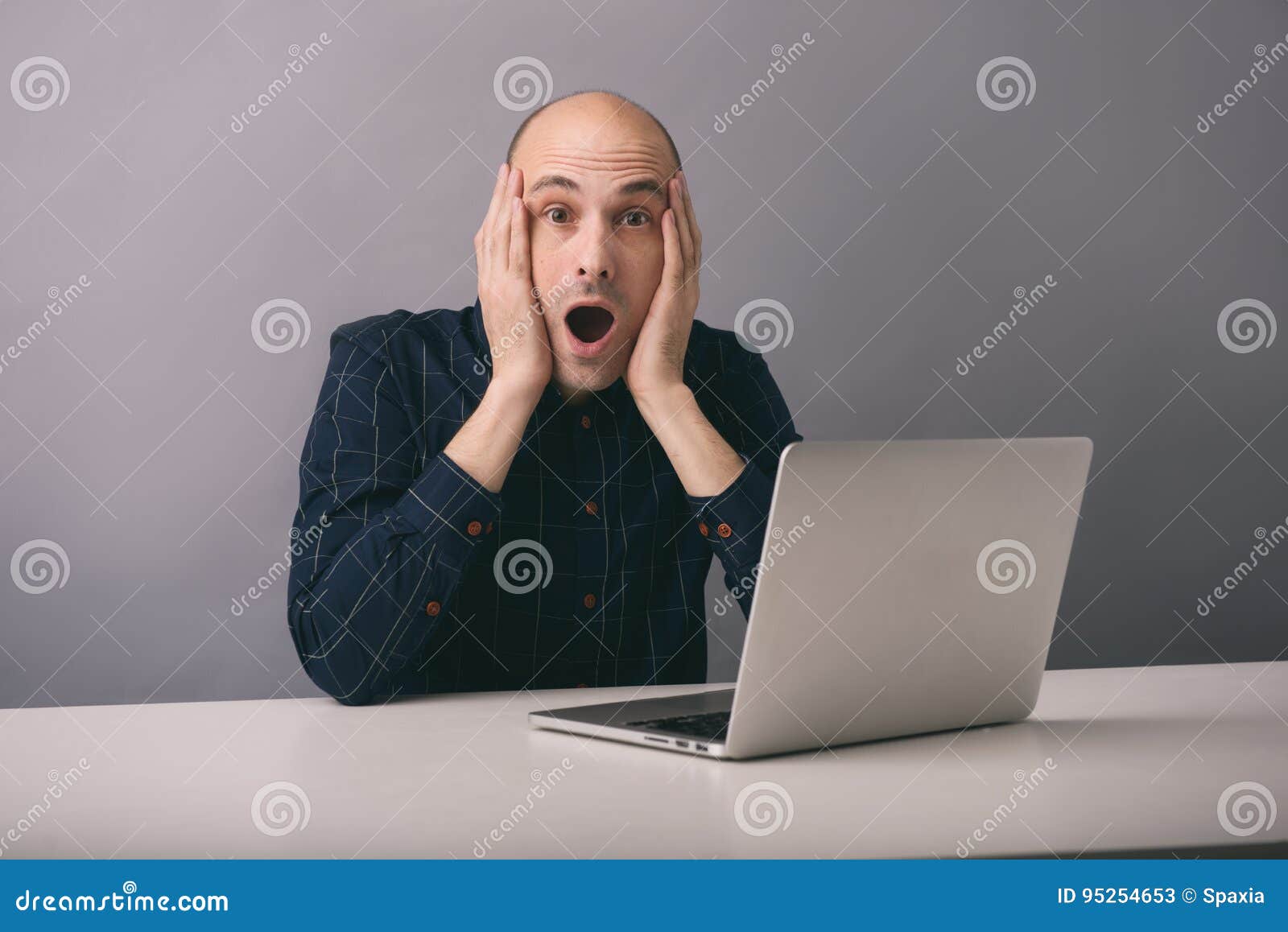 Surprised Man Sits Behind a Laptop Stock Image - Image of male, private ...