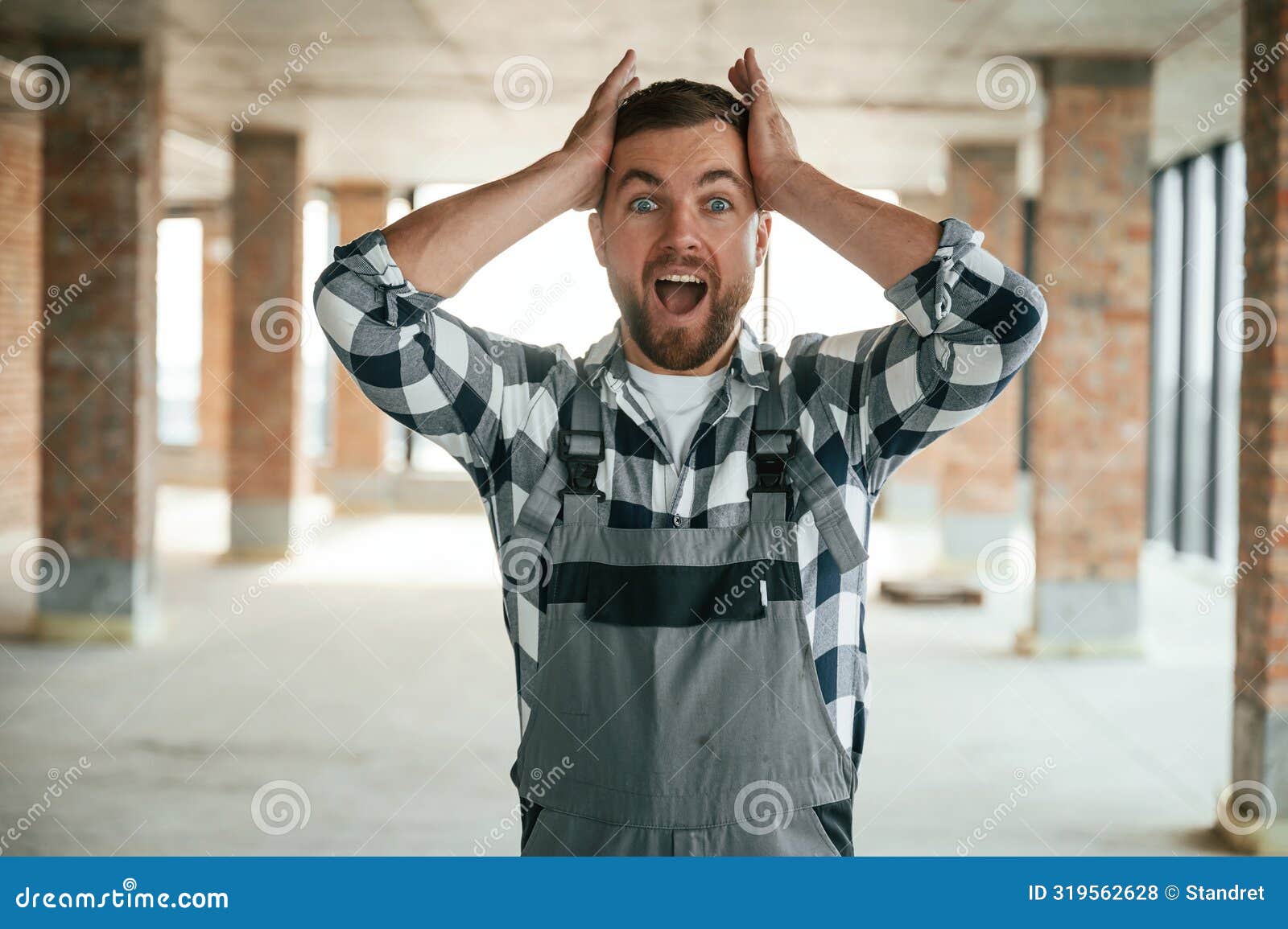 Surprised and Shocked. Construction Worker in Uniform in Empty ...