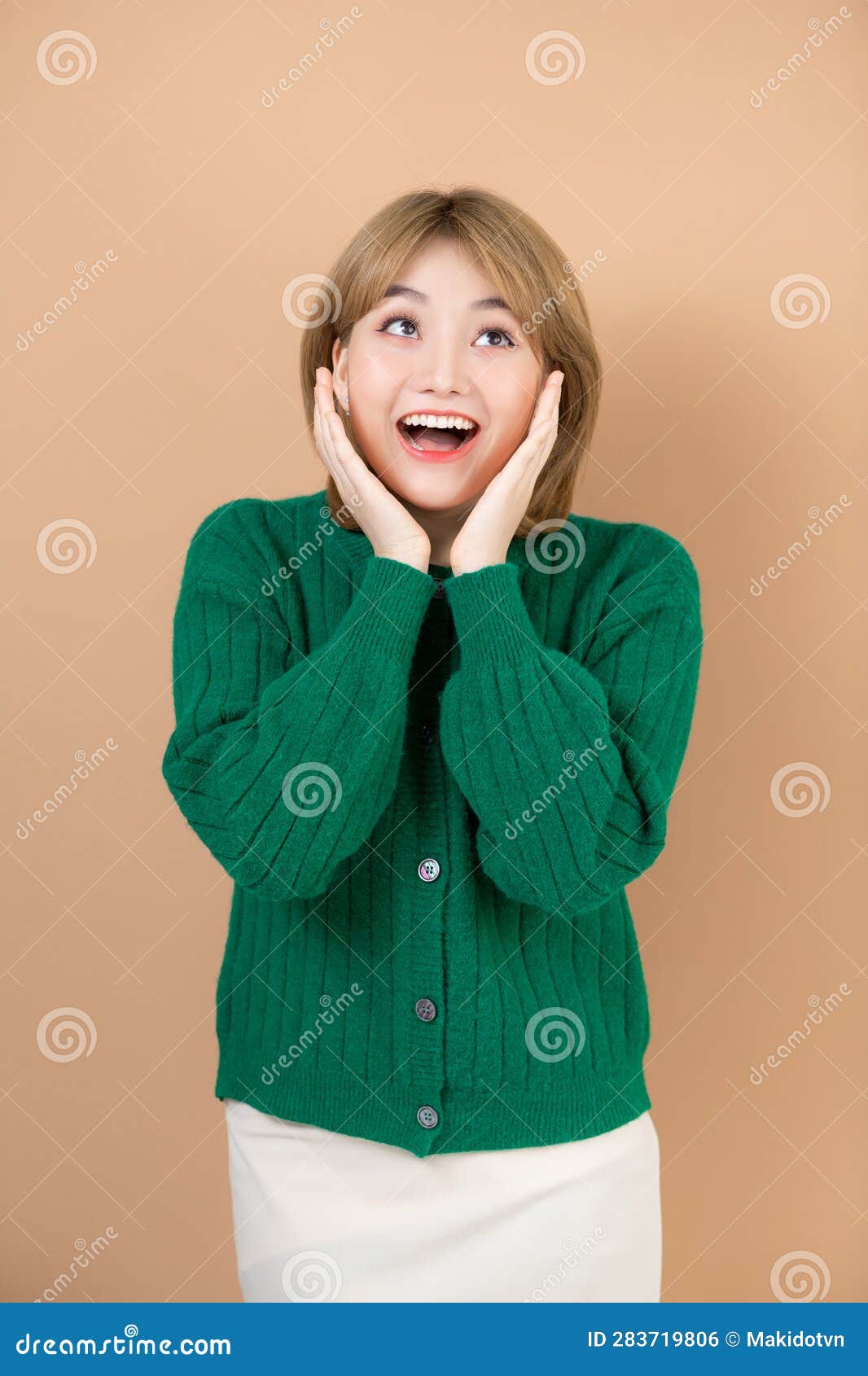 Surprised Shocked Excited Asian Woman Face Isolated on Beige Background ... Surprised Shocked Excited Asian Woman Face Isolated on Beige Background ...