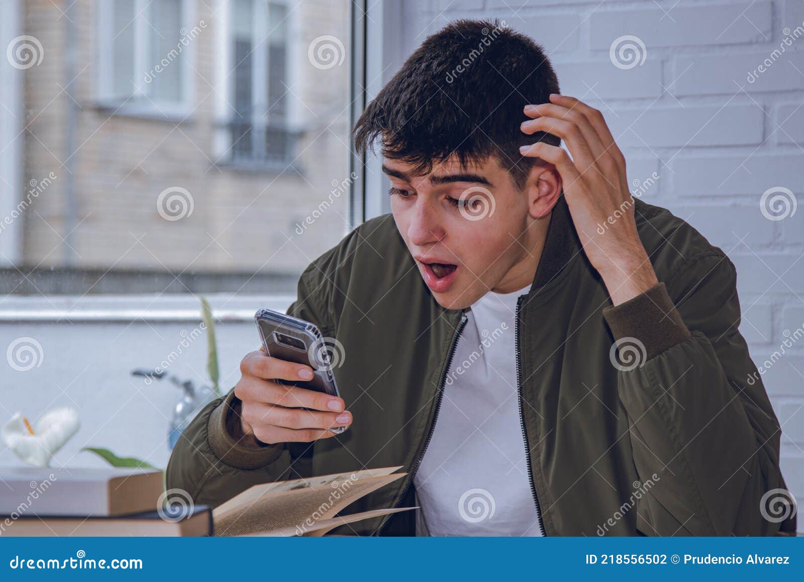 Surprised Student Looking at the Mobile Stock Photo - Image of ...