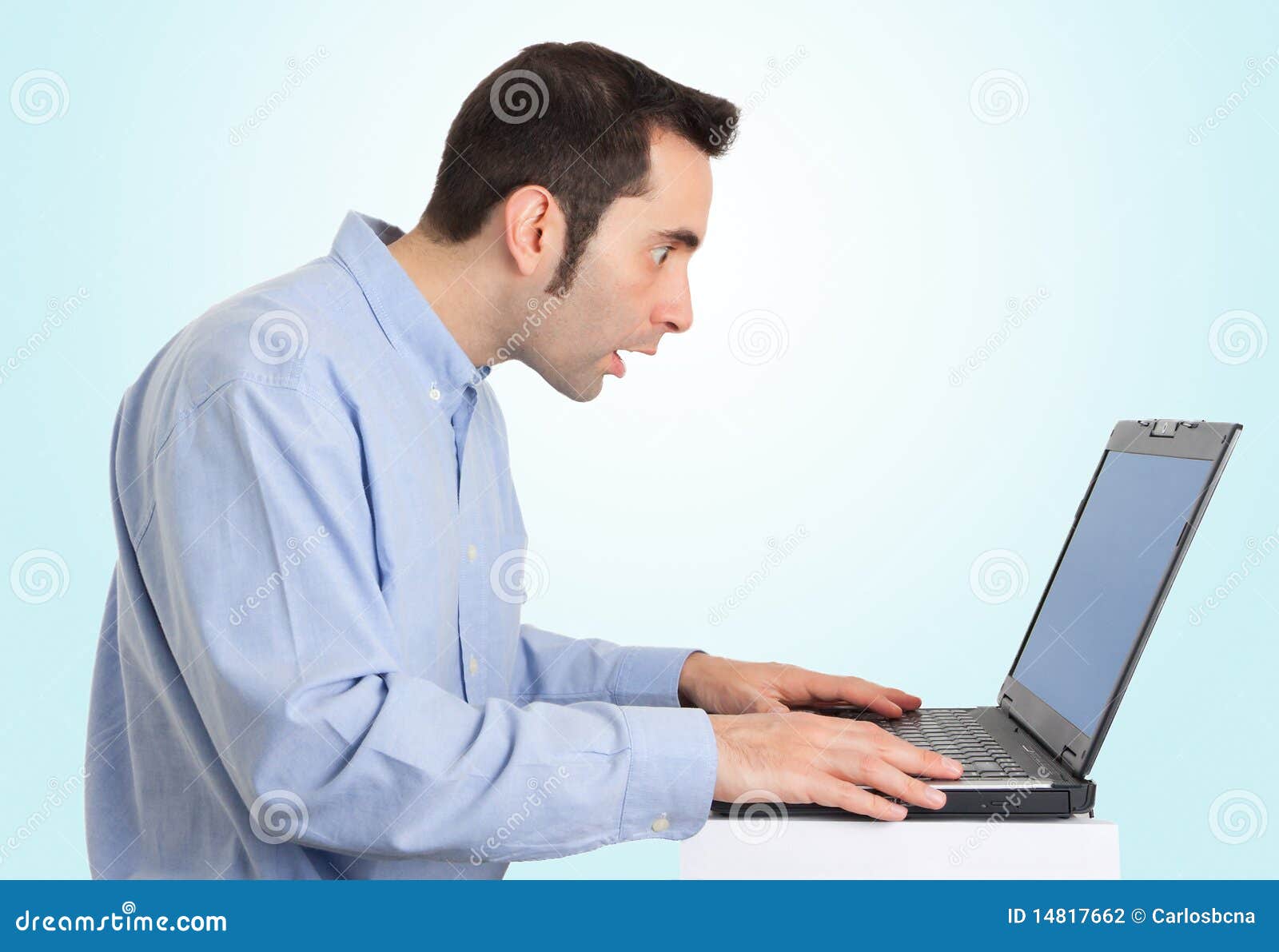 Surprised while Using His Laptop Stock Photo - Image of amazed, shirt ...