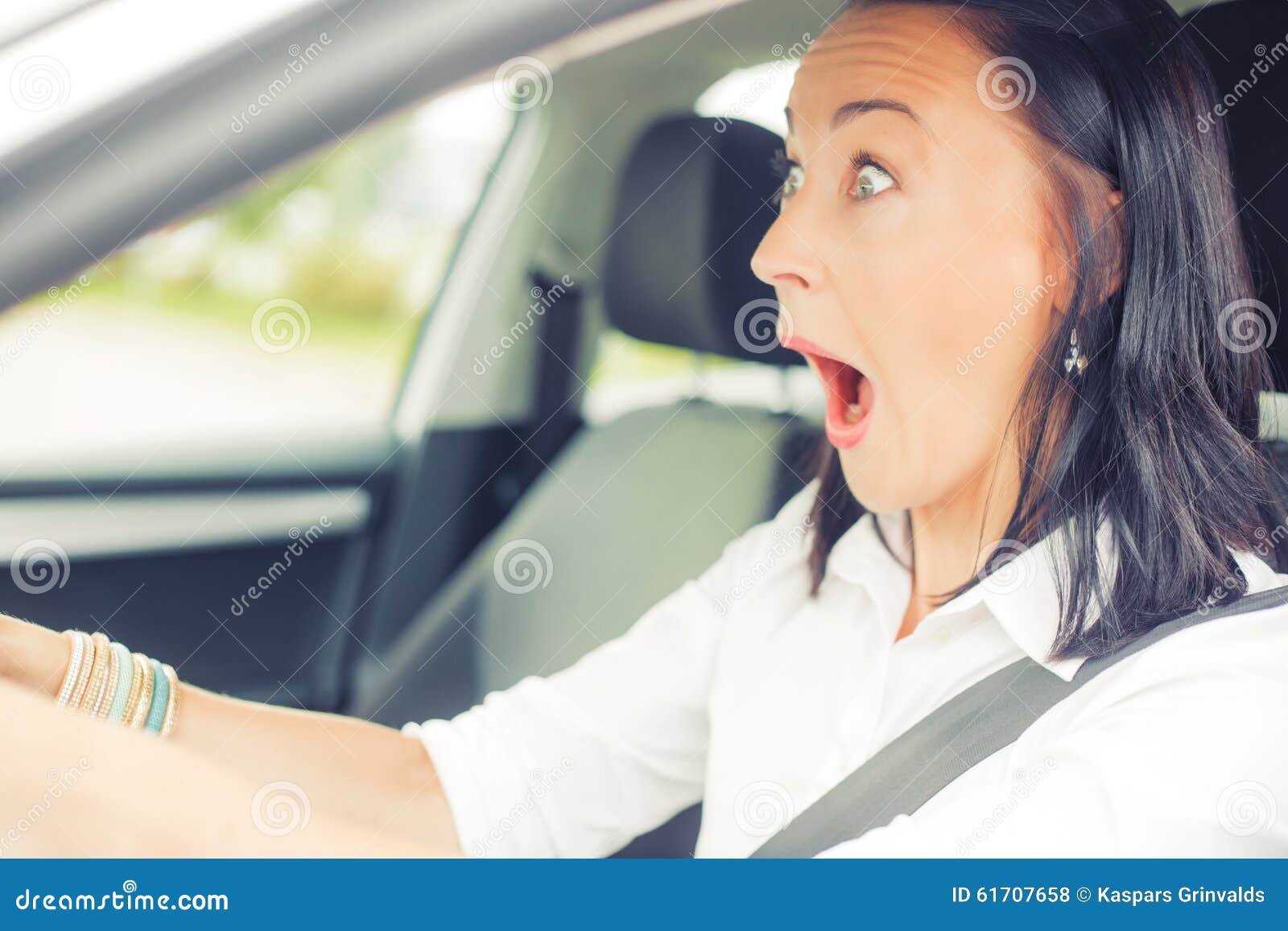 Surprised woman in the car stock photo. Image of motor - 61707658