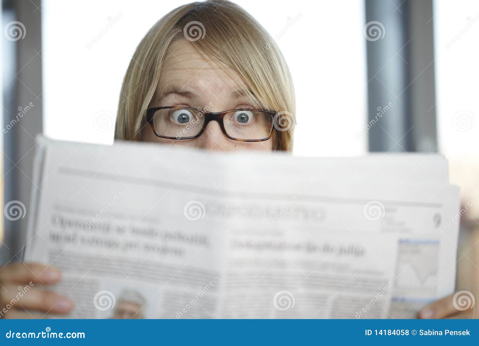 Surprised Woman with Glasses Reading a Newspaper Stock Photo - Image of ...