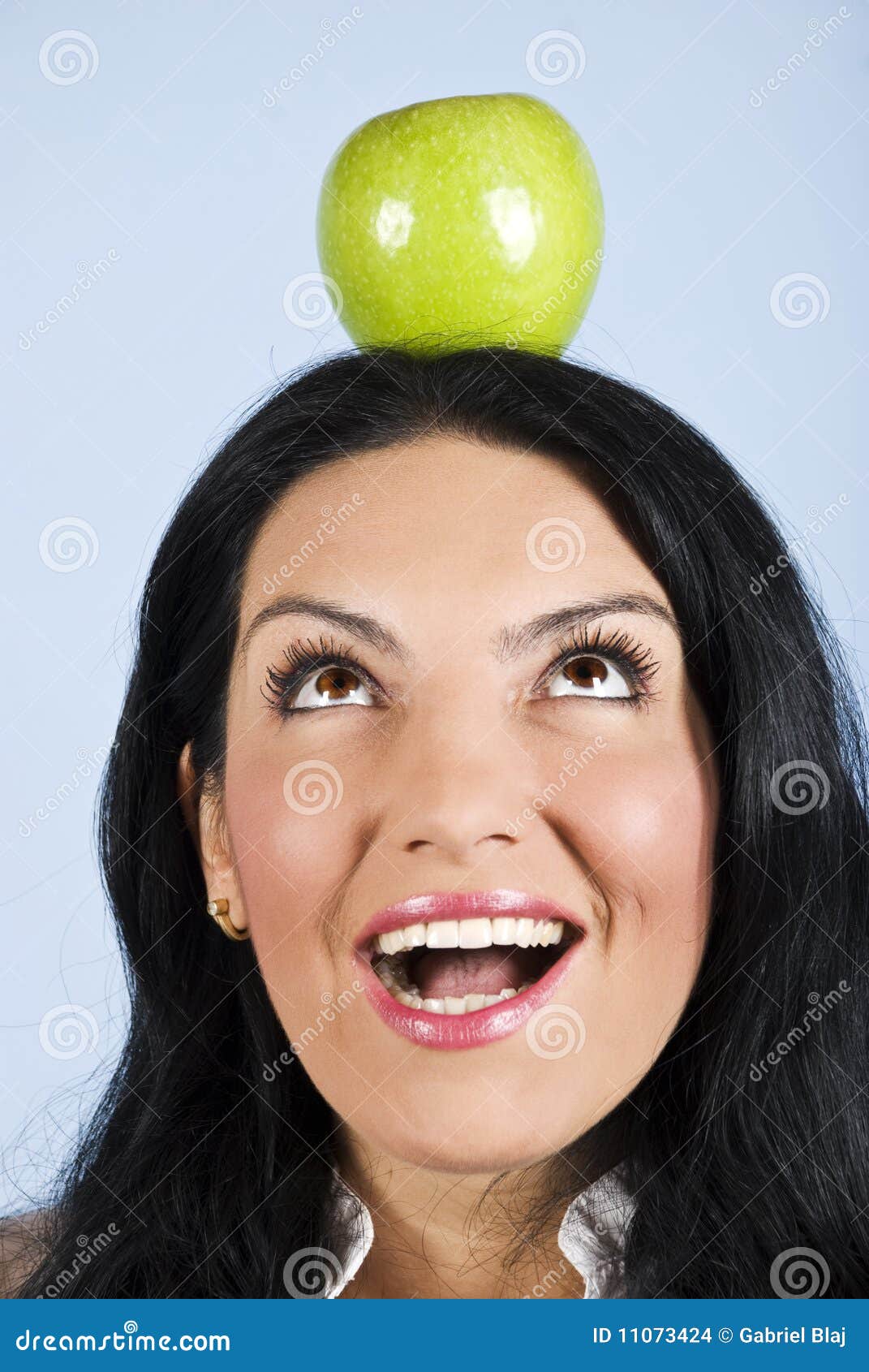 Surprised Woman Hold an Apple on Head Stock Photo - Image of friendly ...