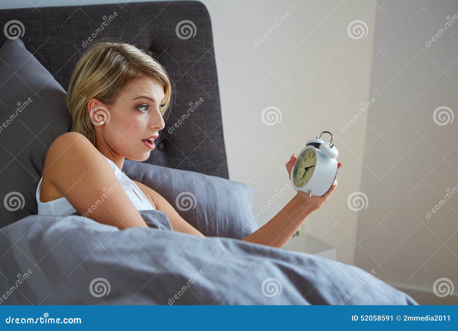 Surprised Woman Looking at Alarm Clock Stock Image - Image of hand ...