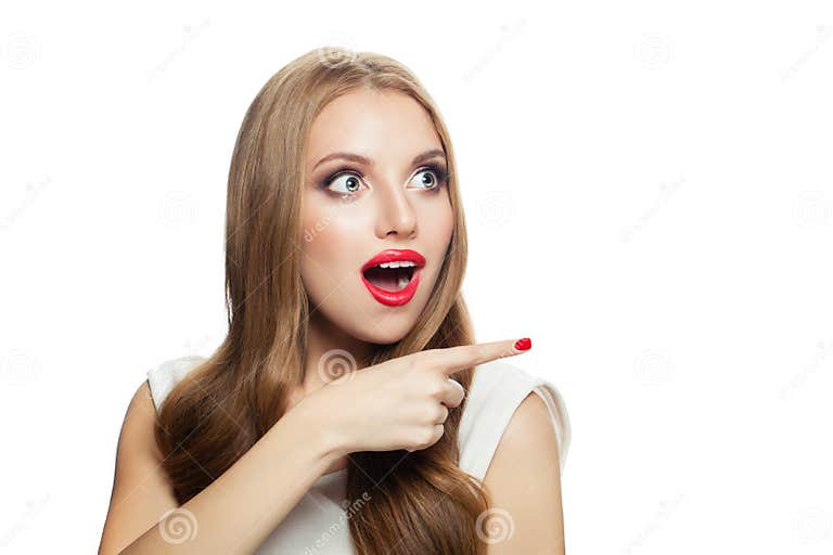Surprised Woman Model With Open Mouth Pointing Finger Isolated On White