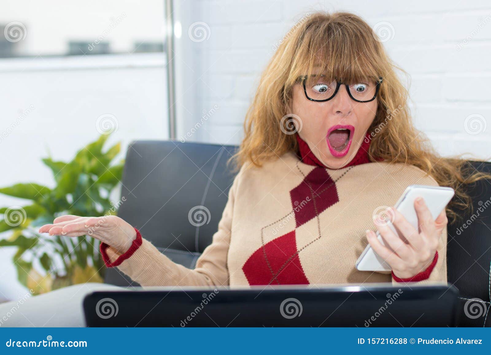 Woman watching the phone stock photo. Image of media - 157216288