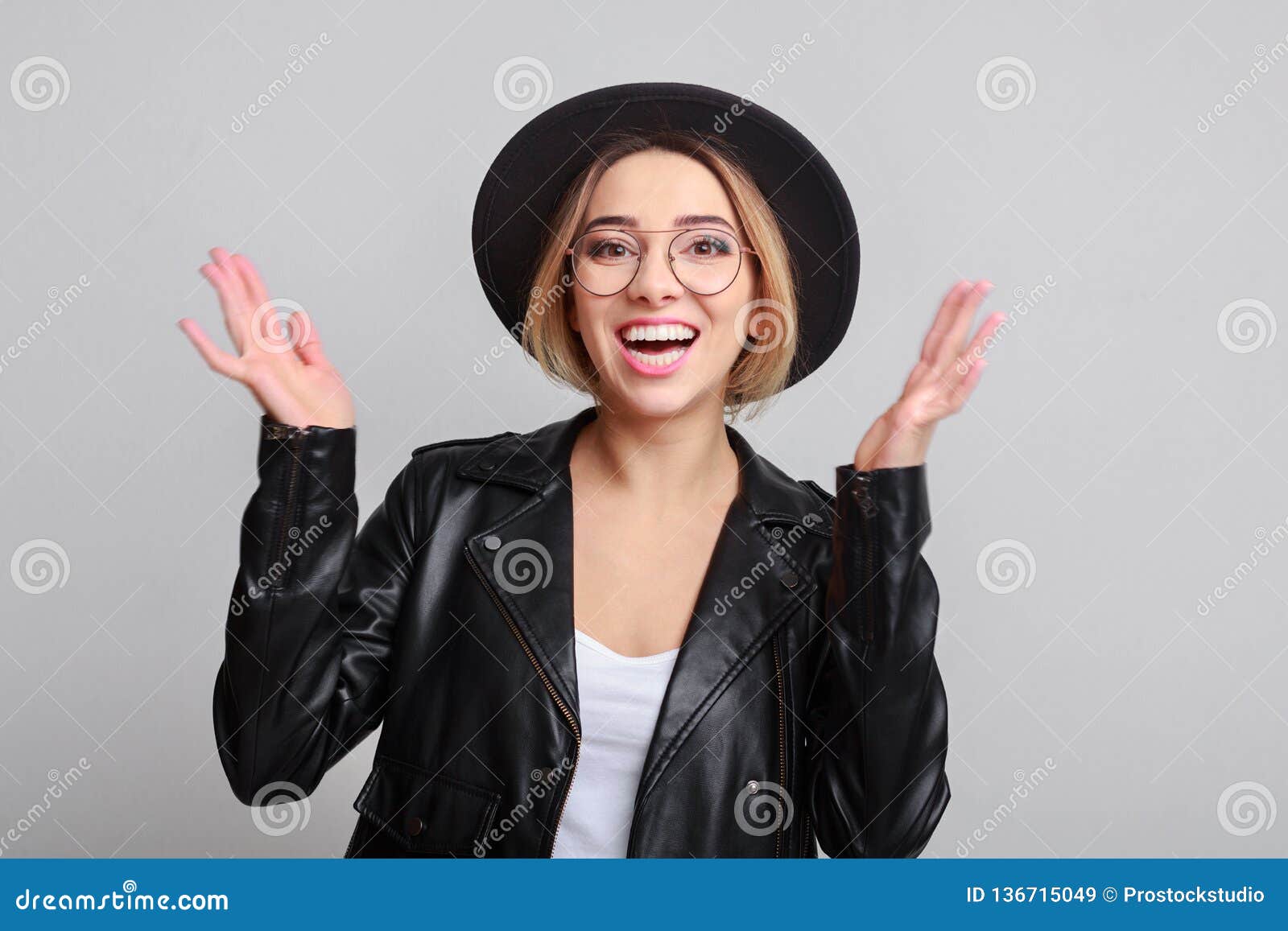 Surprised Woman Wearing Leather Jacket Over Studio Background Stock ...