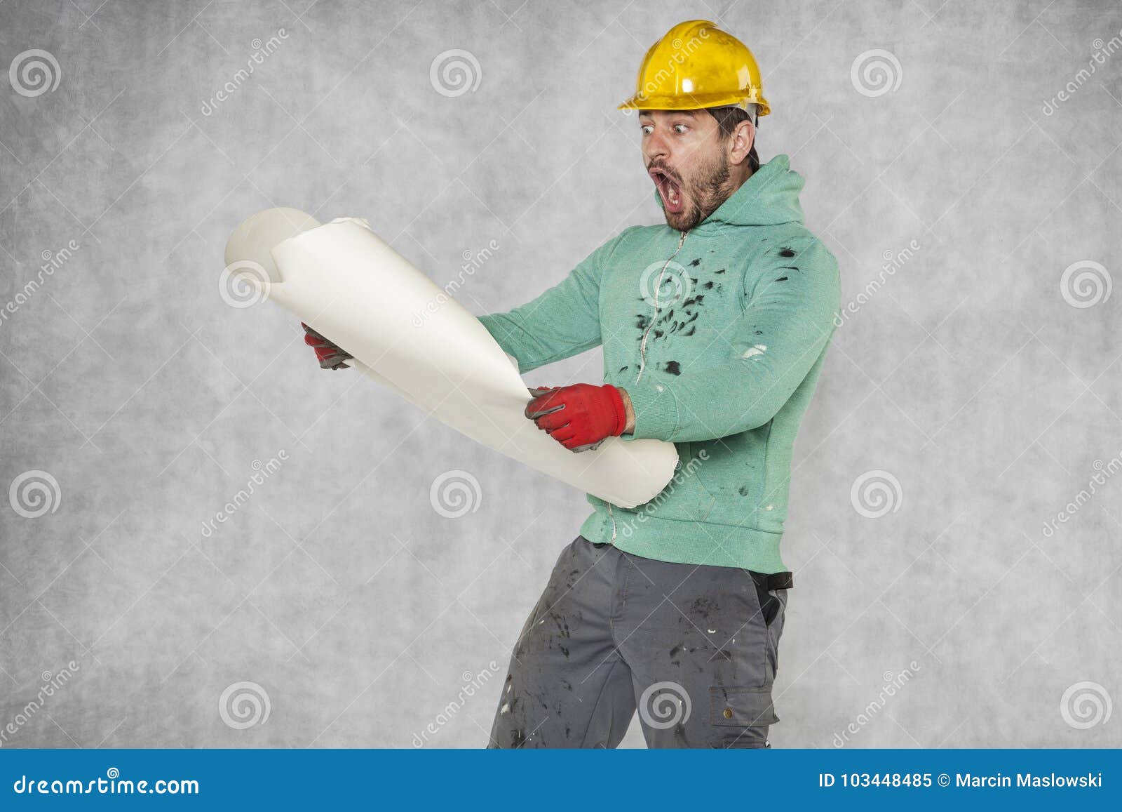 Surprised Worker In His 50s With Helmet Standing Outside And Holding A ...