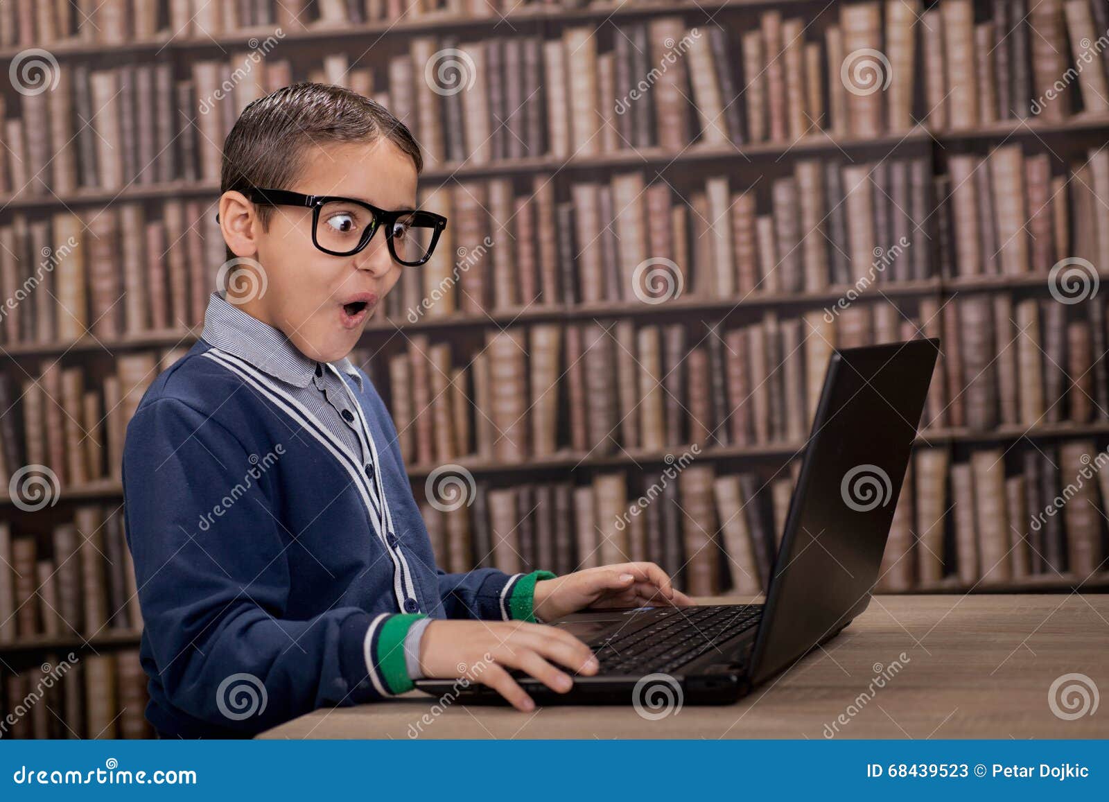 Surprised Young Boy in the Library with Computer Stock Image - Image of ...